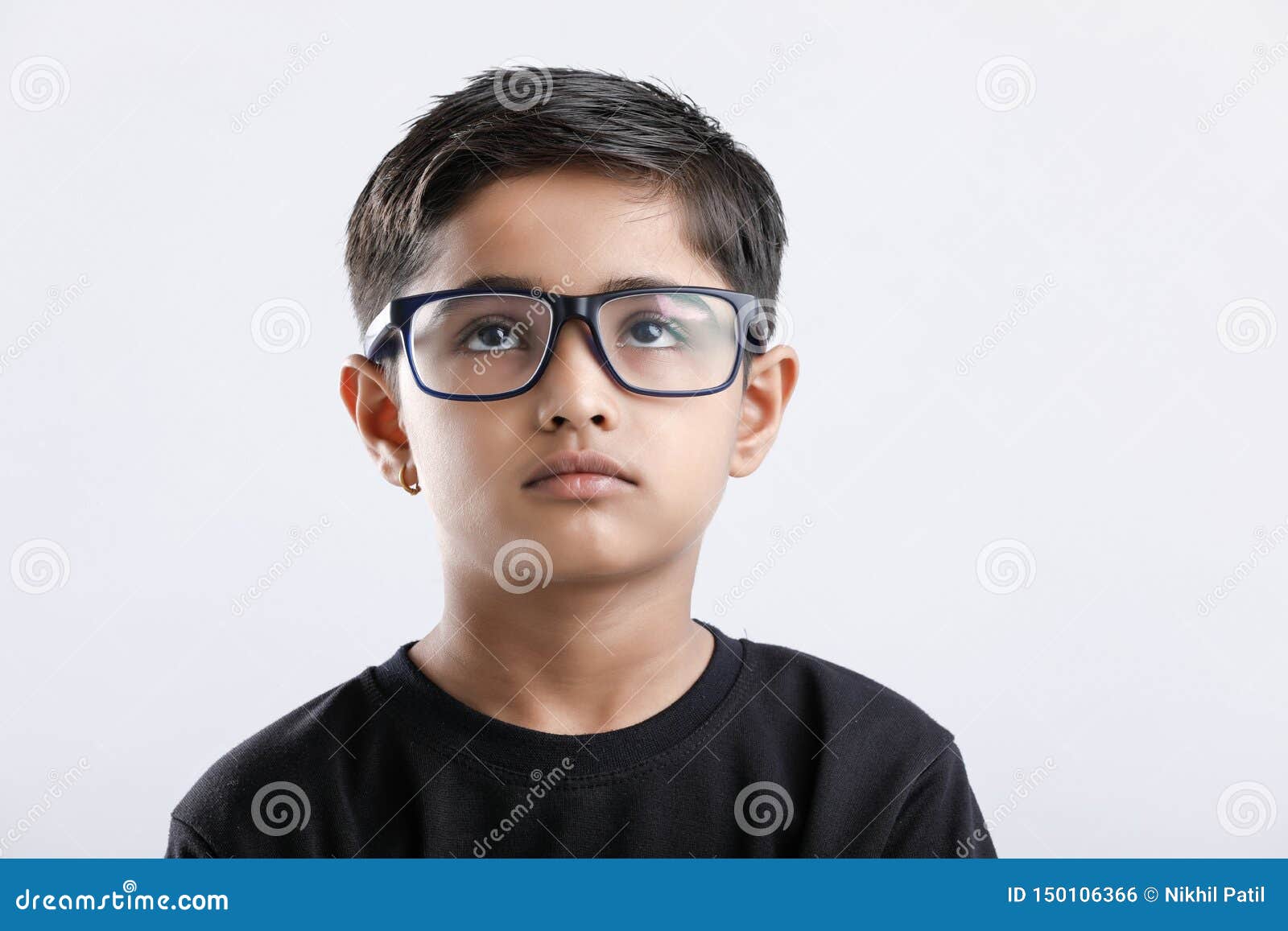 Indian Child Wearing Spectacles and Looking Seriously Stock Photo ...