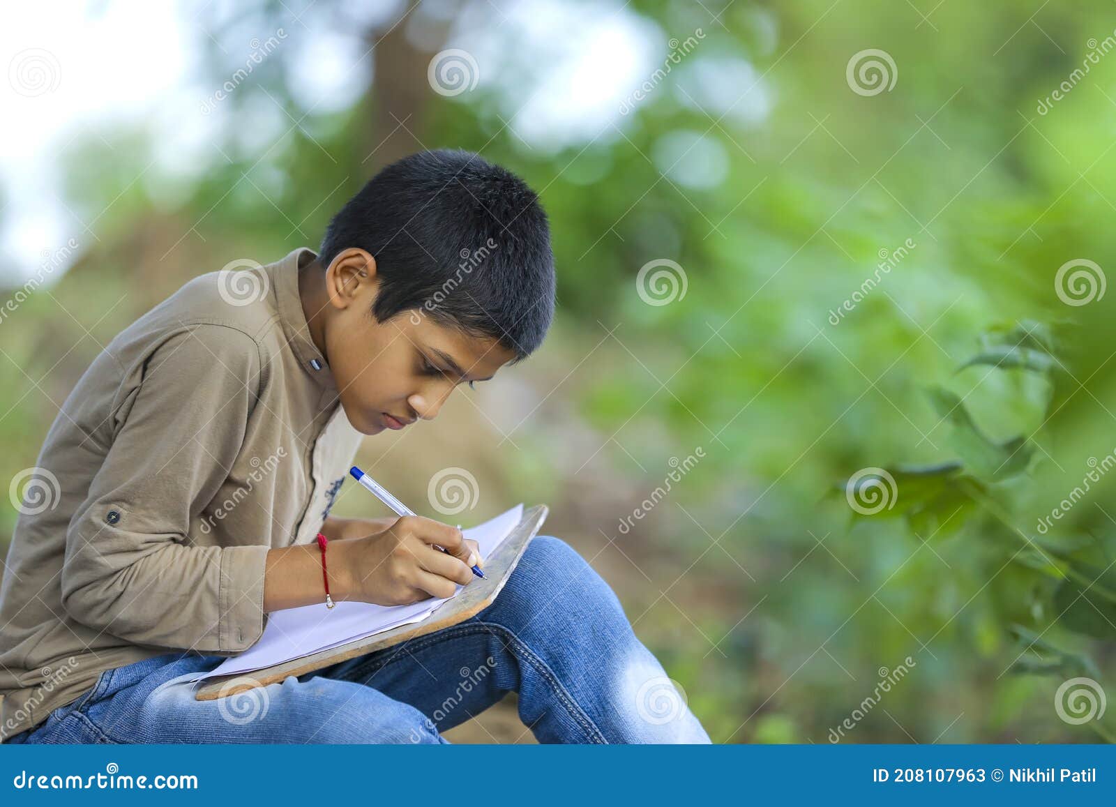 Indian Child Writing on Note Book Stock Image - Image of book, child ...