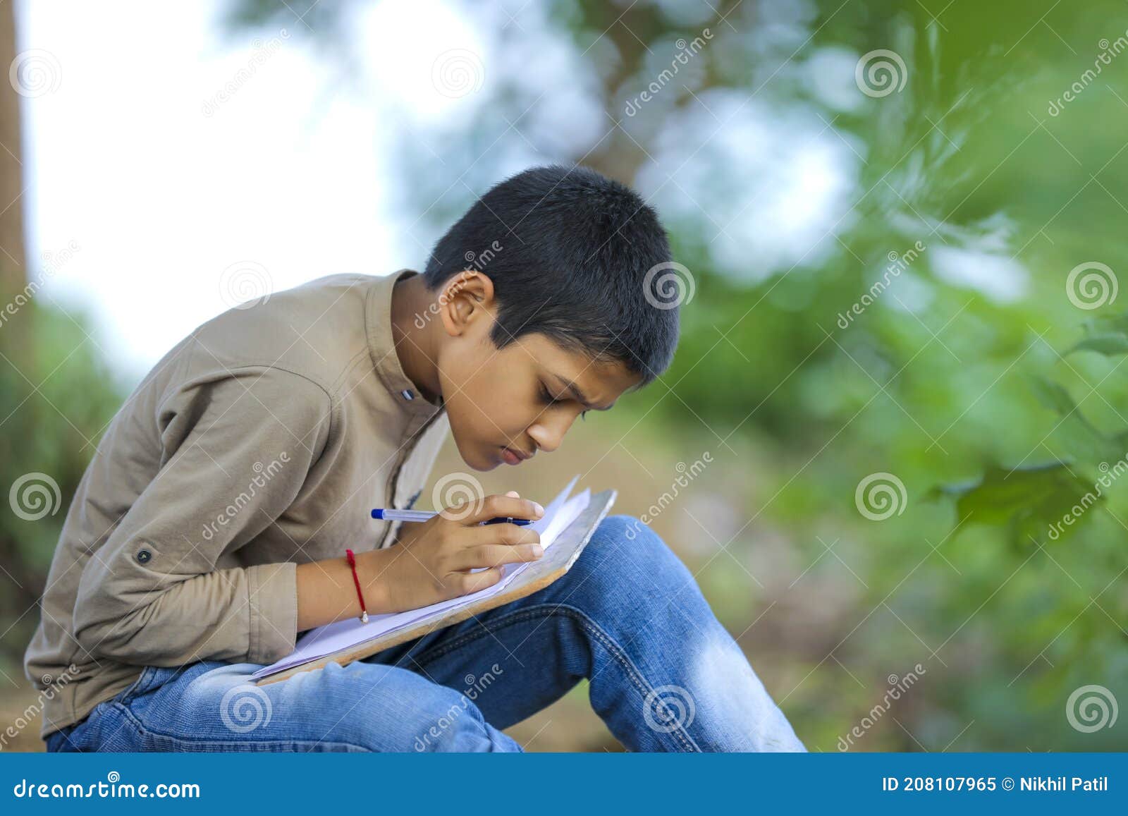 Indian Child Writing on Note Book Stock Image - Image of emotion ...