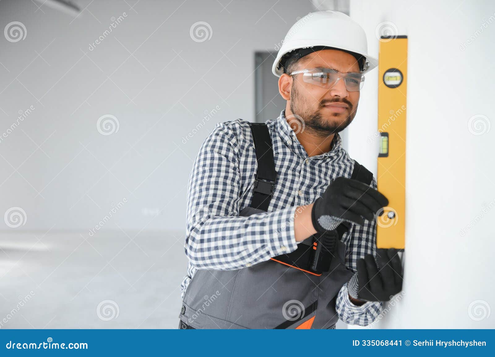 Indian Construction Worker with Mustache Uses Water Level Measuring ...