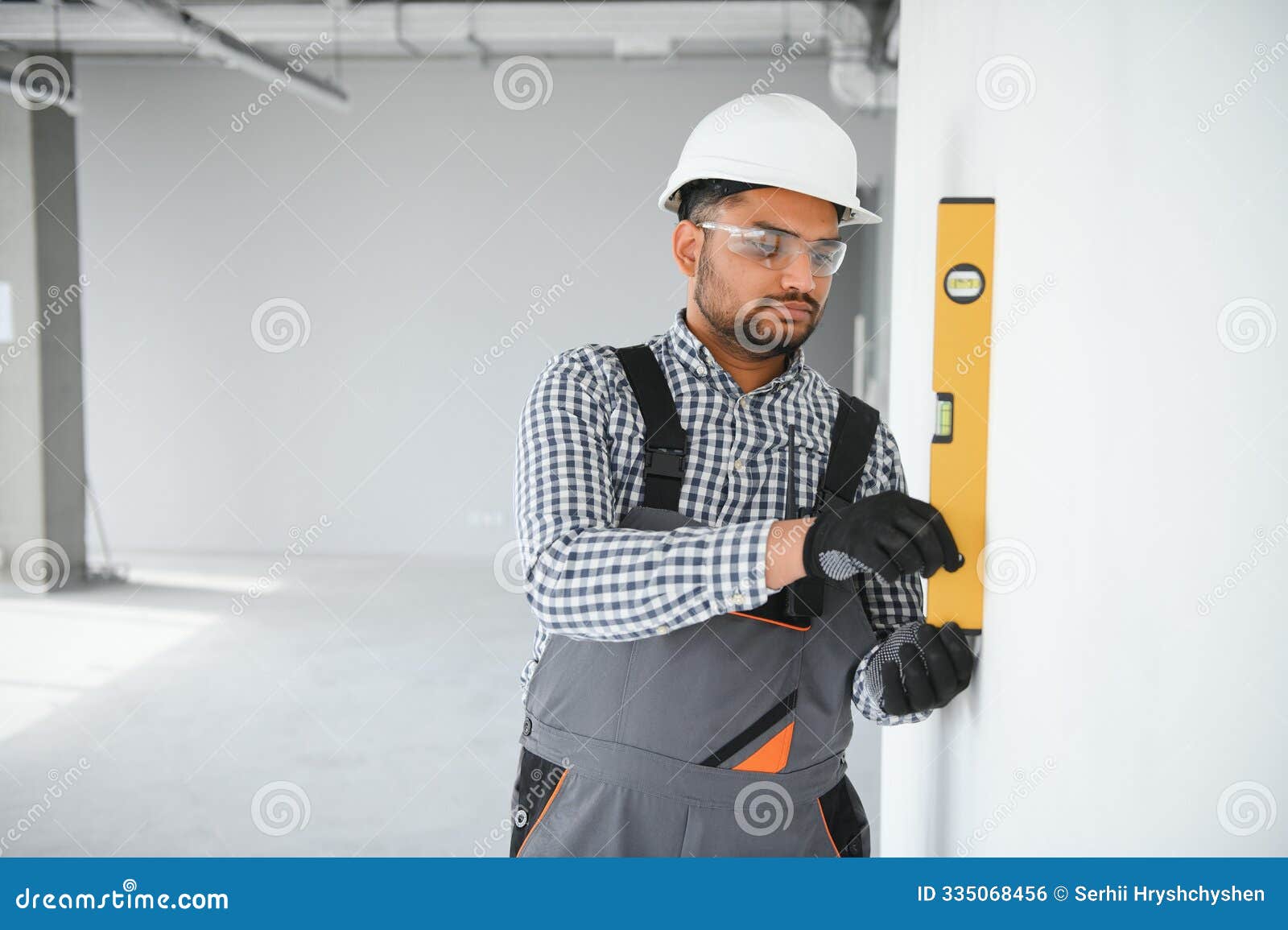 Indian Construction Worker with Mustache Uses Water Level Measuring ...