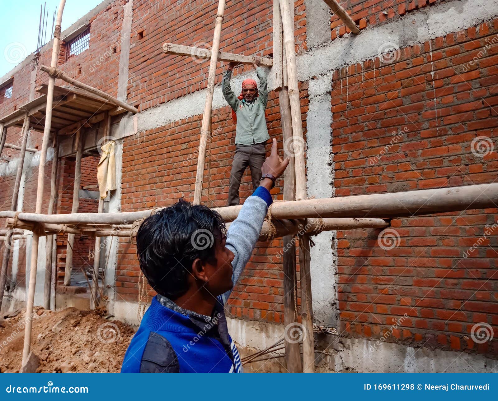 An Indian Contractor Giving Instructions To the Labour during Building ... An Indian Contractor Giving Instructions To the Labour during Building ...