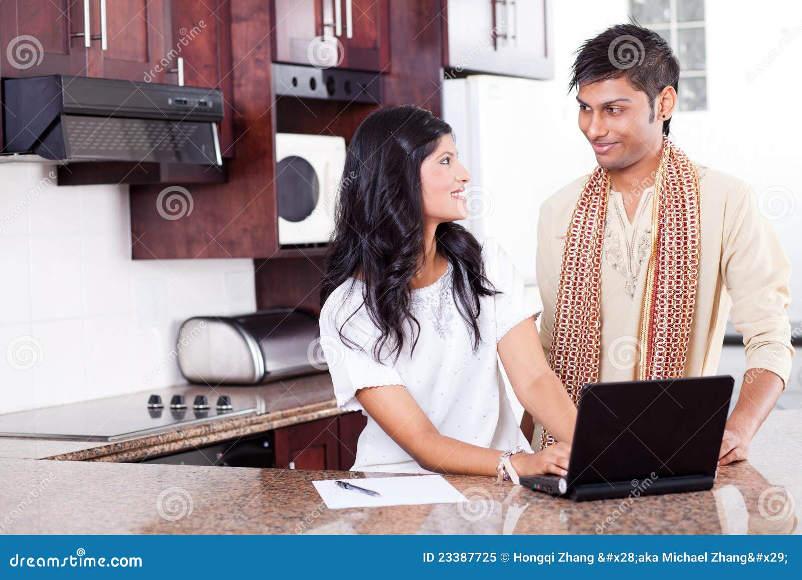 Indian couple using laptop stock image. Image of beautiful - 23387725