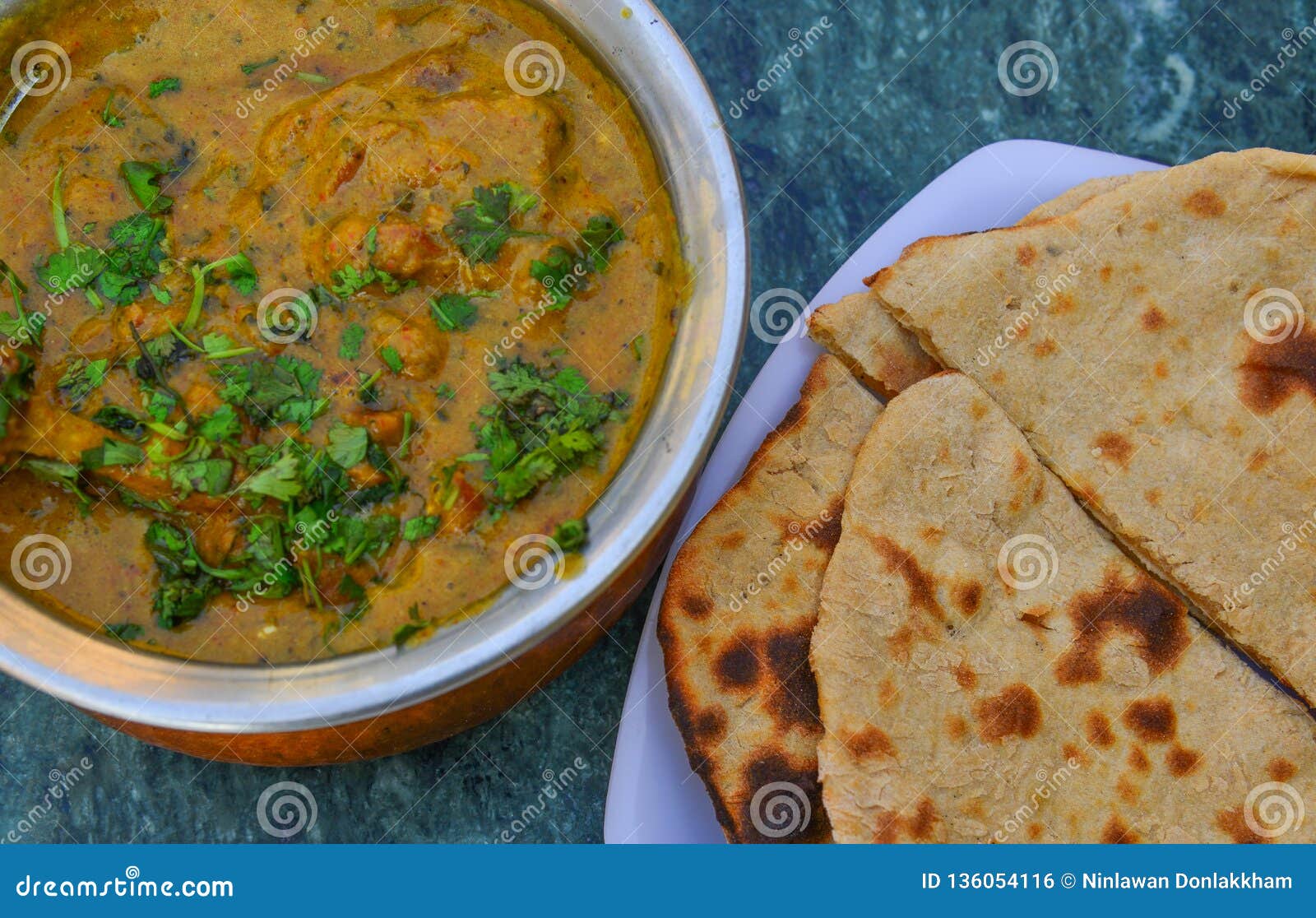 Indian Curry with Roti Bread Stock Photo - Image of flat, raisin: 136054116