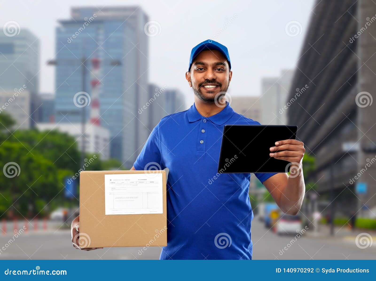 Indian Delivery Man with Tablet Pc and Parcel Box Stock Photo - Image ...