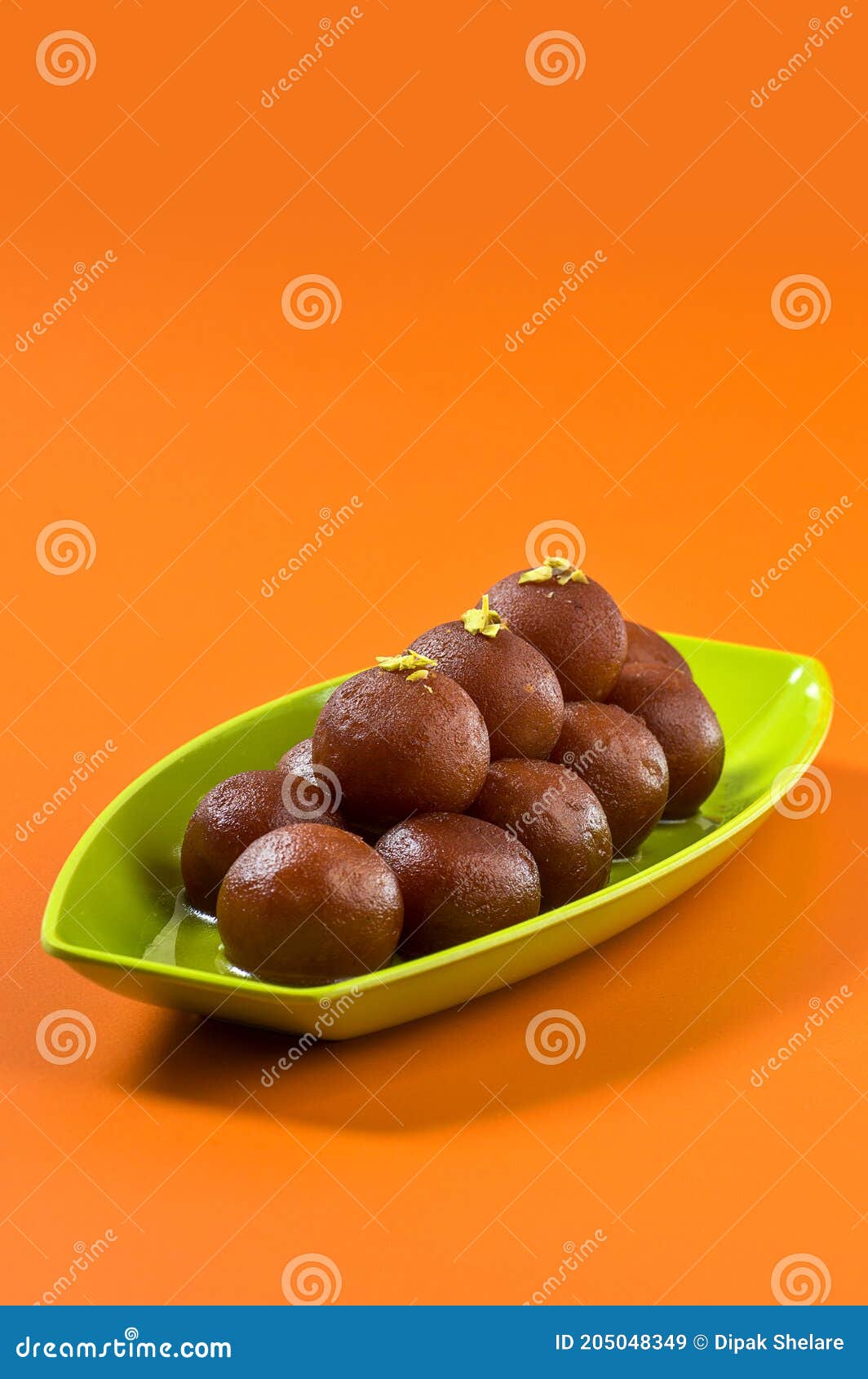 Indian Dessert Gulab Jamun in Plate on Orange Background Stock Image ...