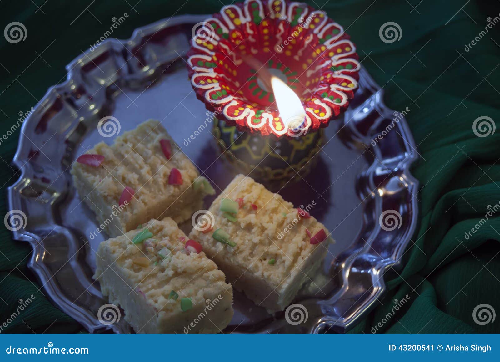 Indian Diwali Sweet Barfi with a Burning Lamp Stock Image - Image of ...