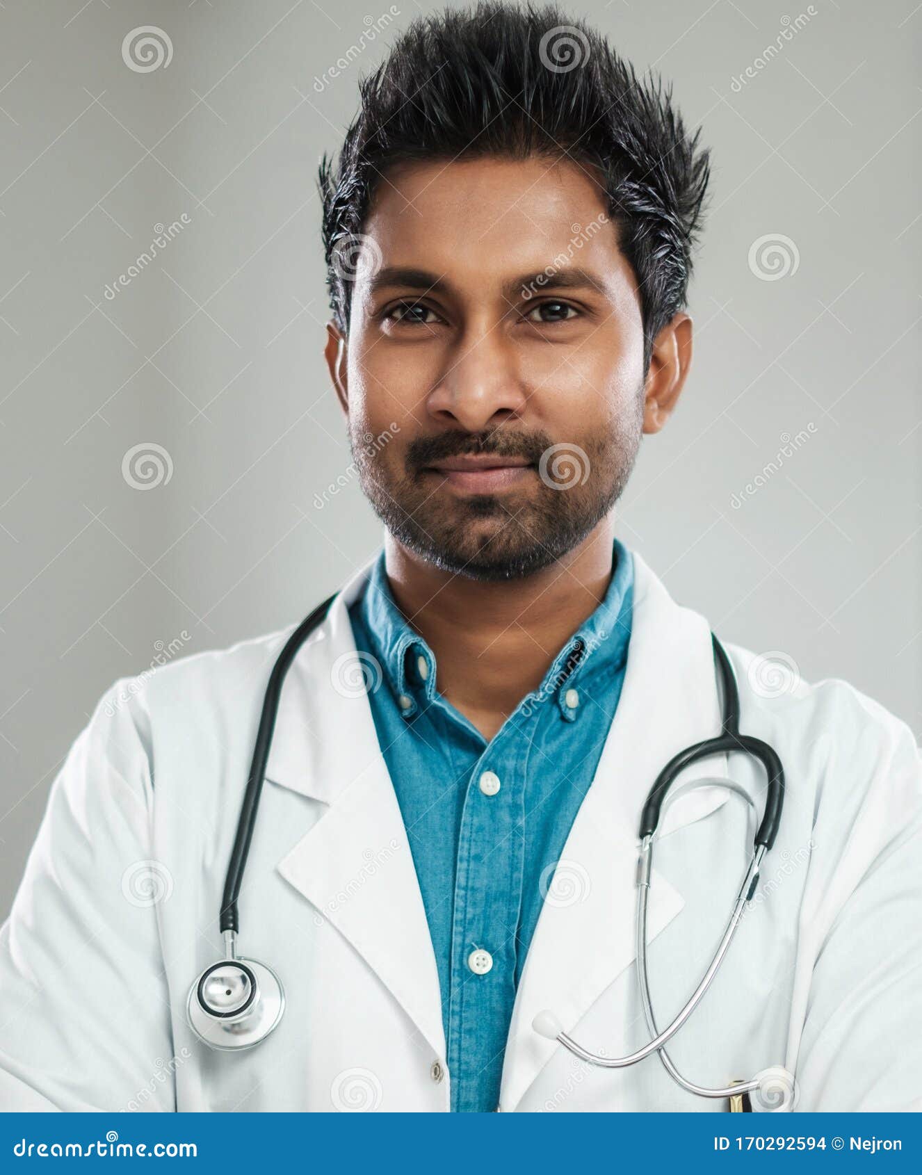 Indian Doctor with Stethoscope Around Neck in His Office Stock Photo ...
