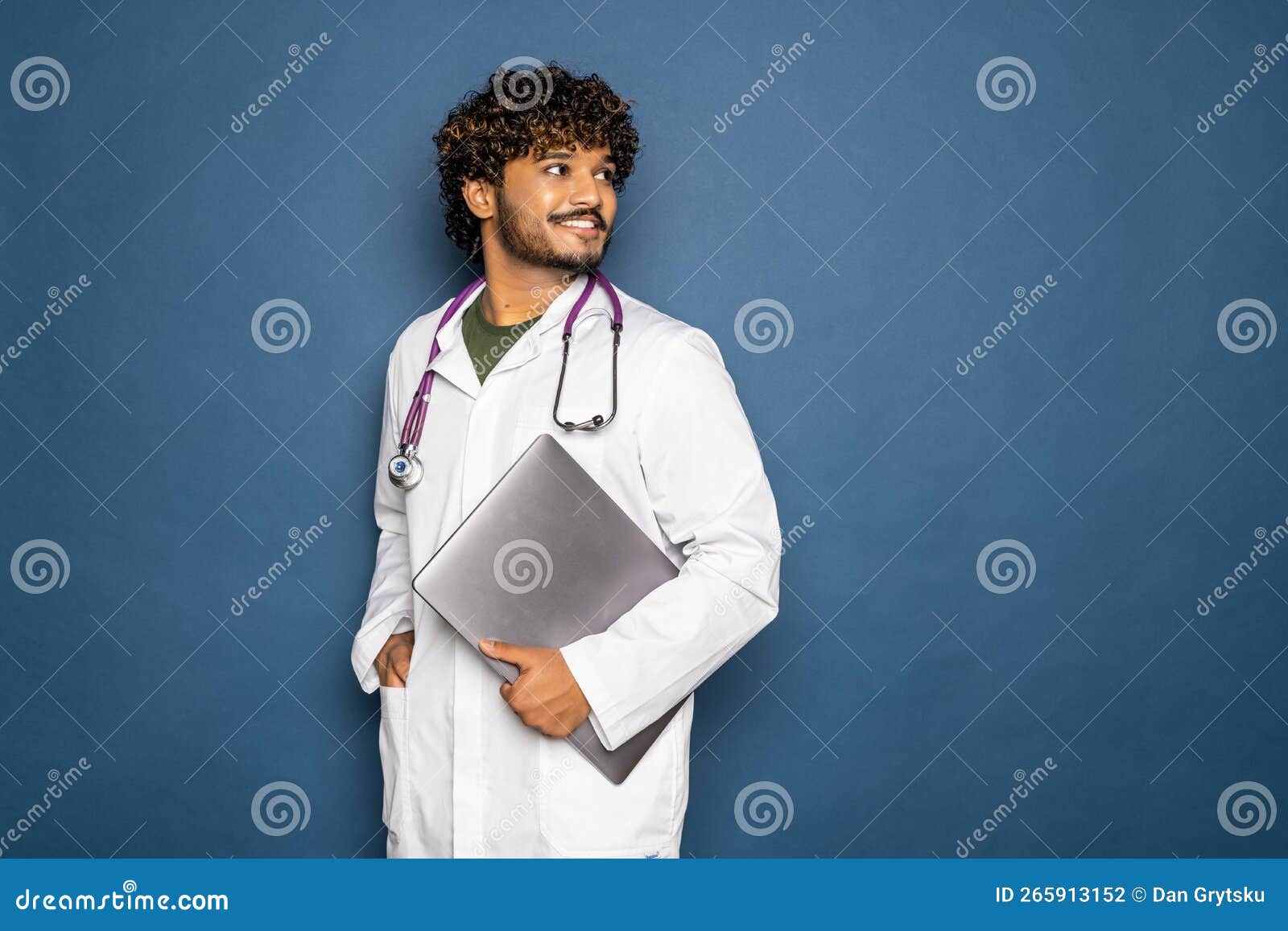 Indian Doctor Working with Laptop, Isolated on Blue Background Stock ...