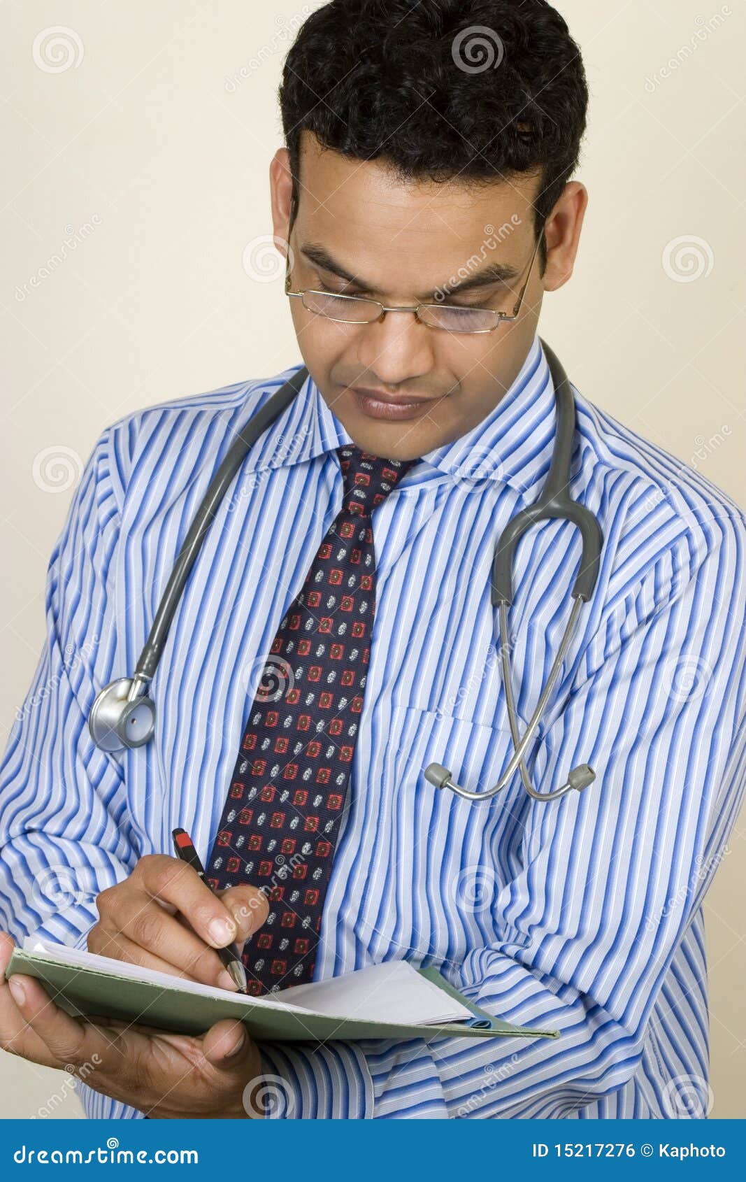 Indian Doctor Writing a Report Stock Photo - Image of dosage ...