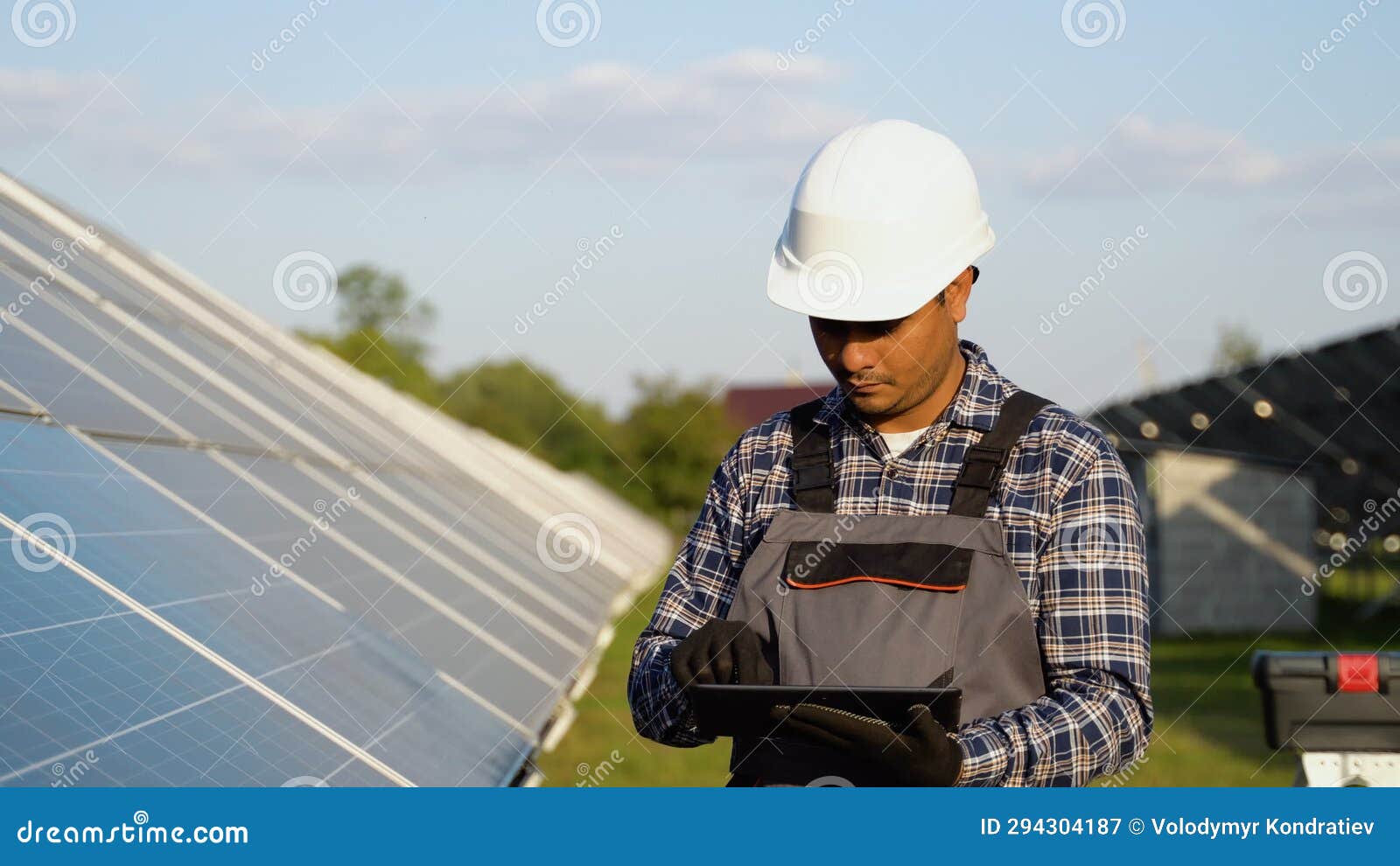 Indian Electrical Engineer Holding Digital Tablet with Solar Panels ...