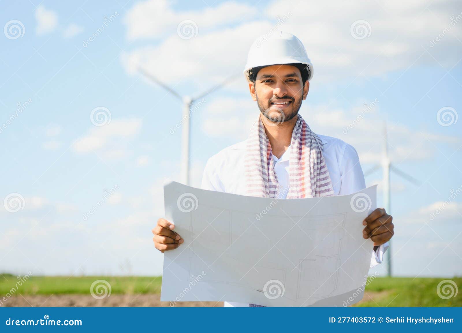 Indian Engineer in Wheat Field Checking on Turbine Production Stock ...