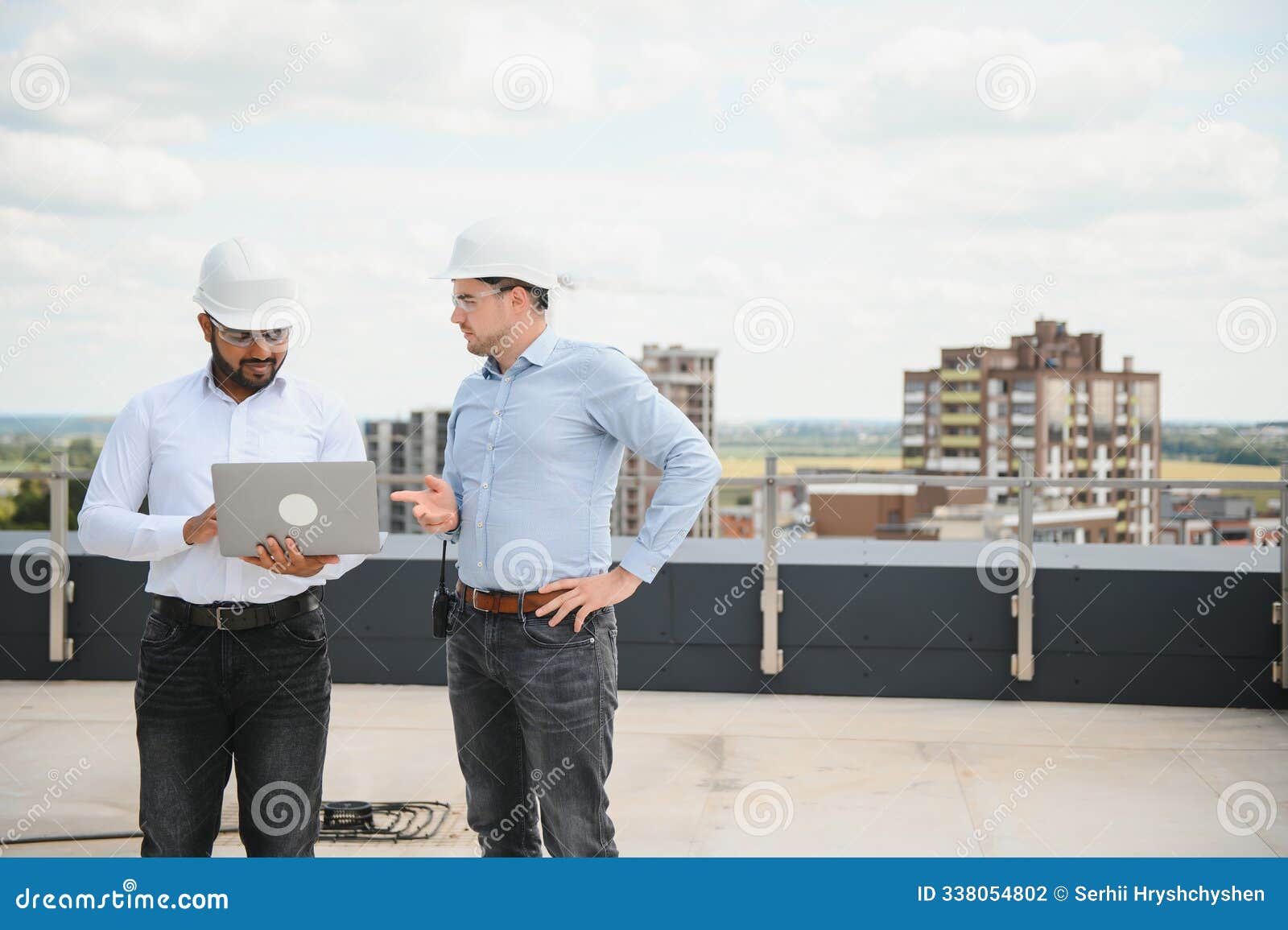 Indian and European Construction Workers Together at a Construction ...