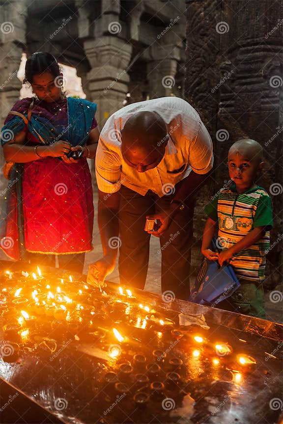 Indian Family Father Mother Son Worshipping by Lighting Ghee Lamps in ... Indian Family Father Mother Son Worshipping by Lighting Ghee Lamps in ...