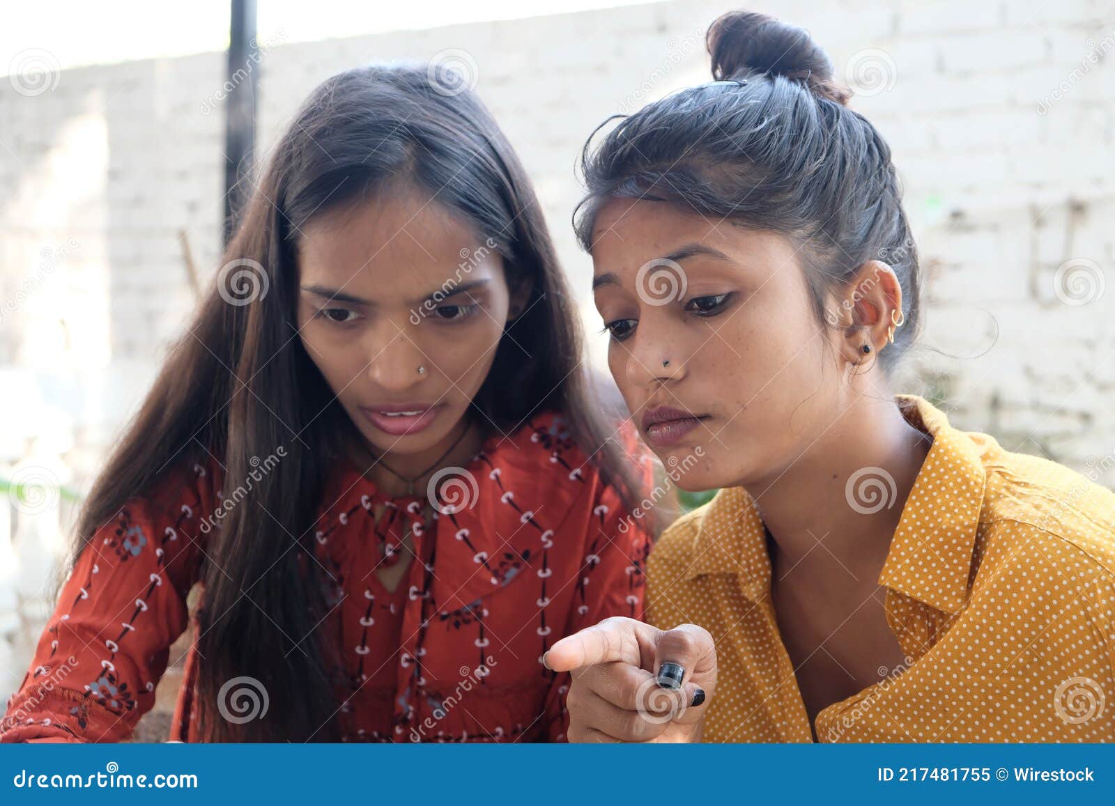 Indian Female Friends Talking and Discussing Something Stock Image ...