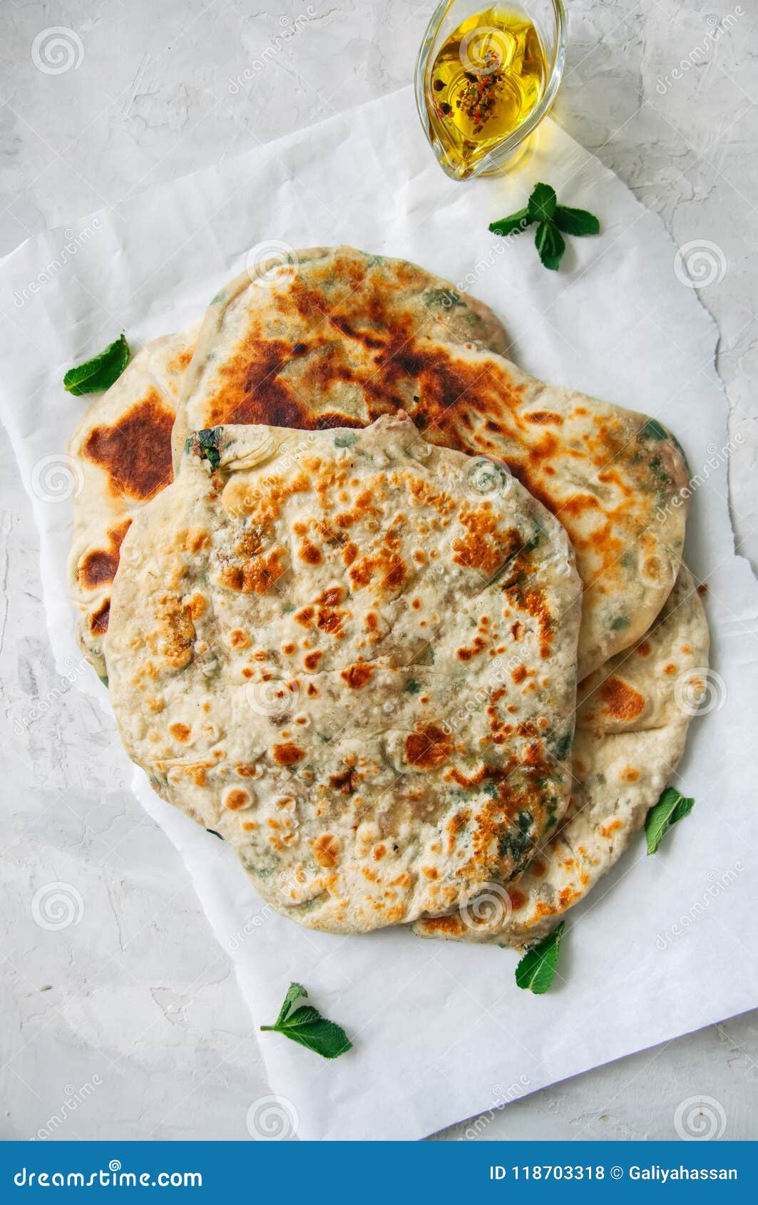 Indian Flatbread.Herb Stuffed Paratha on a Baking Paper Stock Photo ...