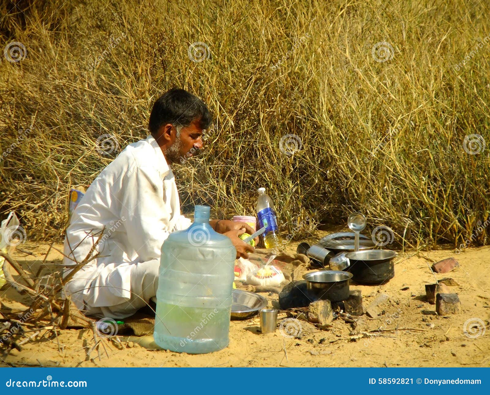Indian Guide Cooking for Tourists during Camel Safari in Thar De ... Indian Guide Cooking for Tourists during Camel Safari in Thar De ...