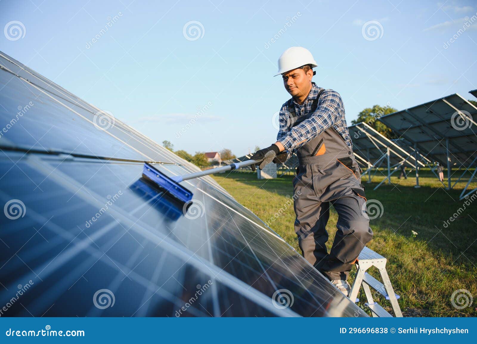 Indian Handyman Cleaning Solar Panels Form Dust and Dirt Stock Photo ...