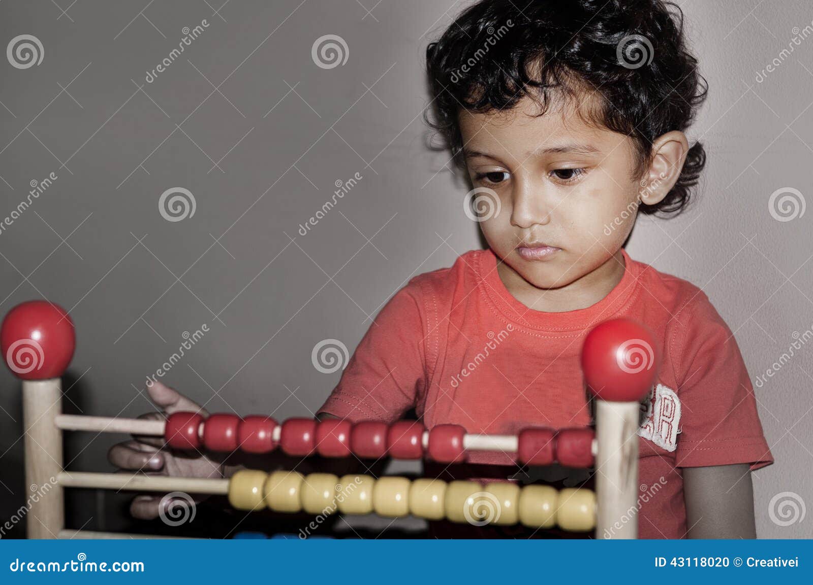 Indian kid playing Abacus stock photo. Image of calculation - 43118020