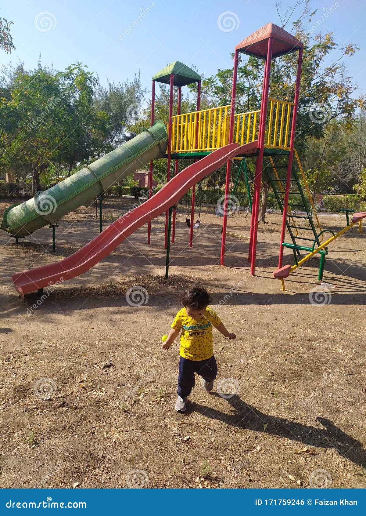 Indian Kid Playing in a Park Near a Slide Stock Photo - Image of indian ...