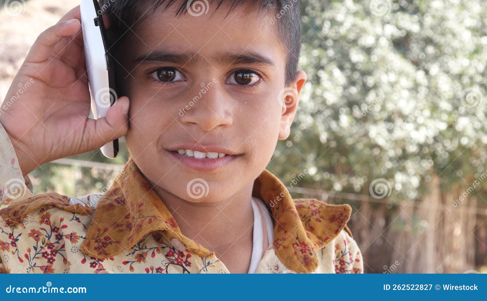 Indian Kid Talking on the Phone and Smiling Stock Image - Image of ...