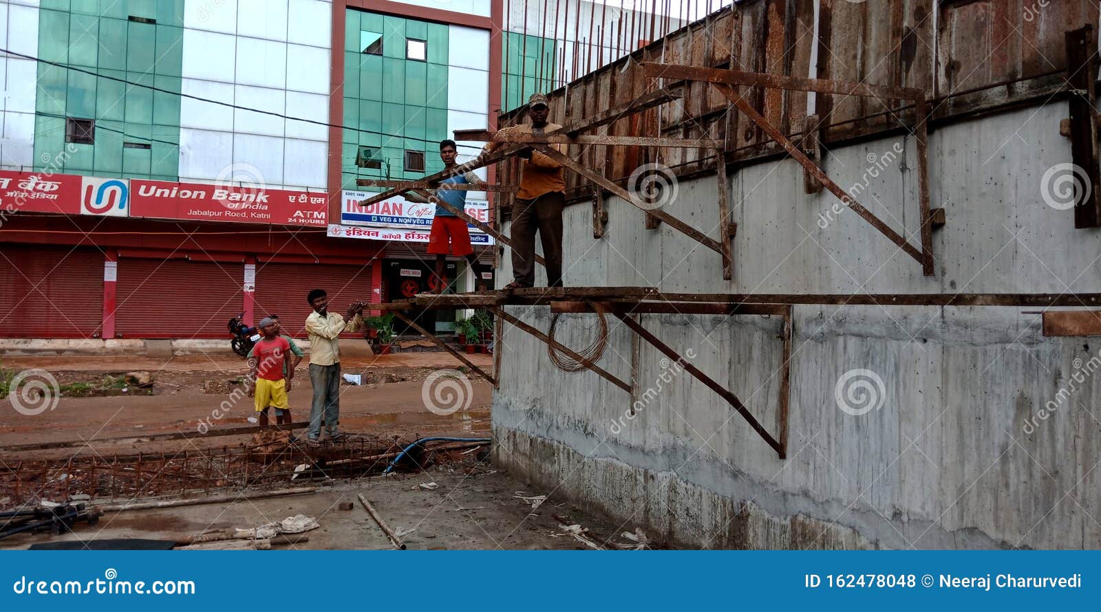 An Indian Labour Fixing Wall From Cement Material And Bricks In India ...
