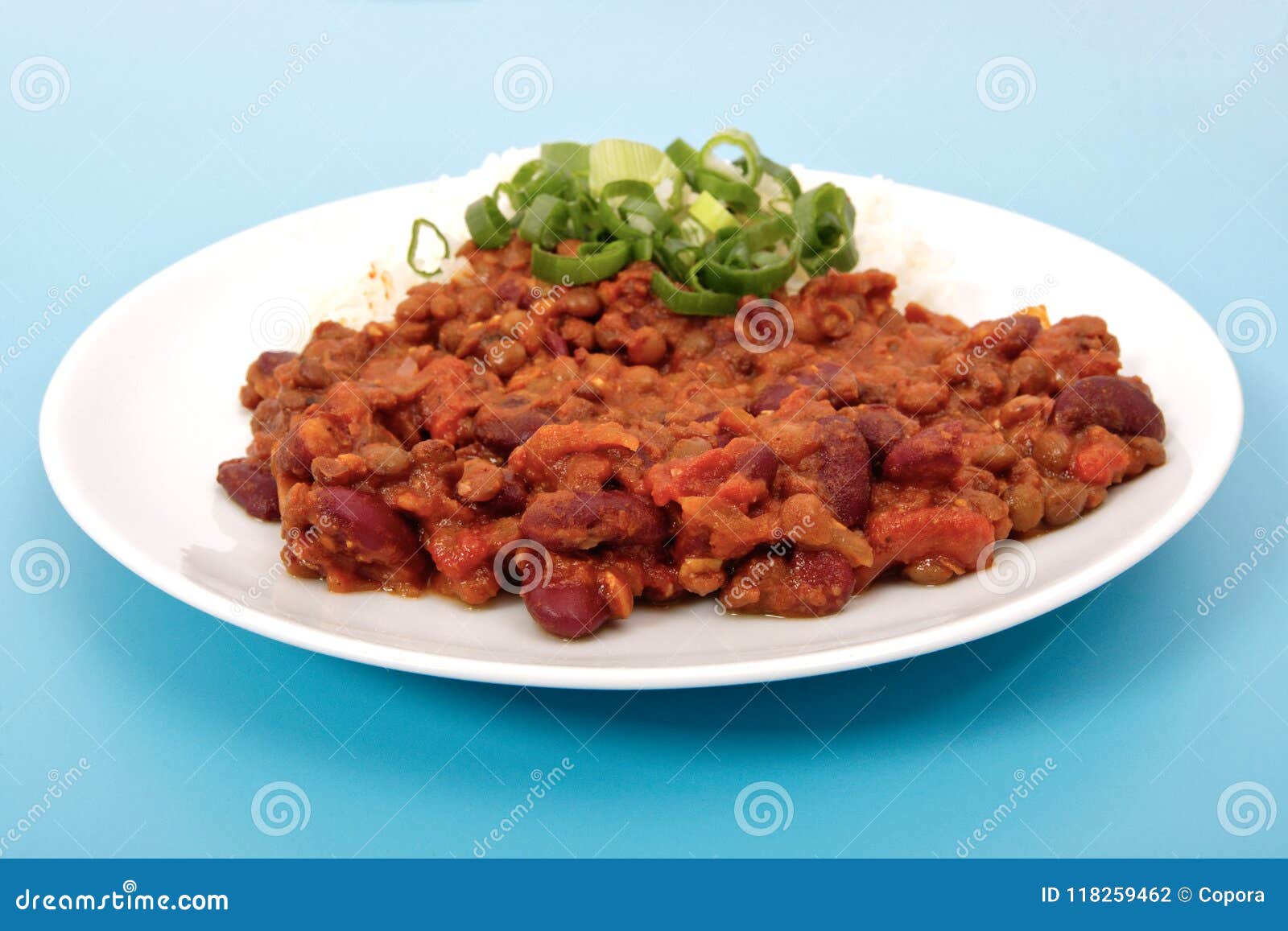 Indian Legume Hash with Rice on a Blue Stock Photo - Image of food ...