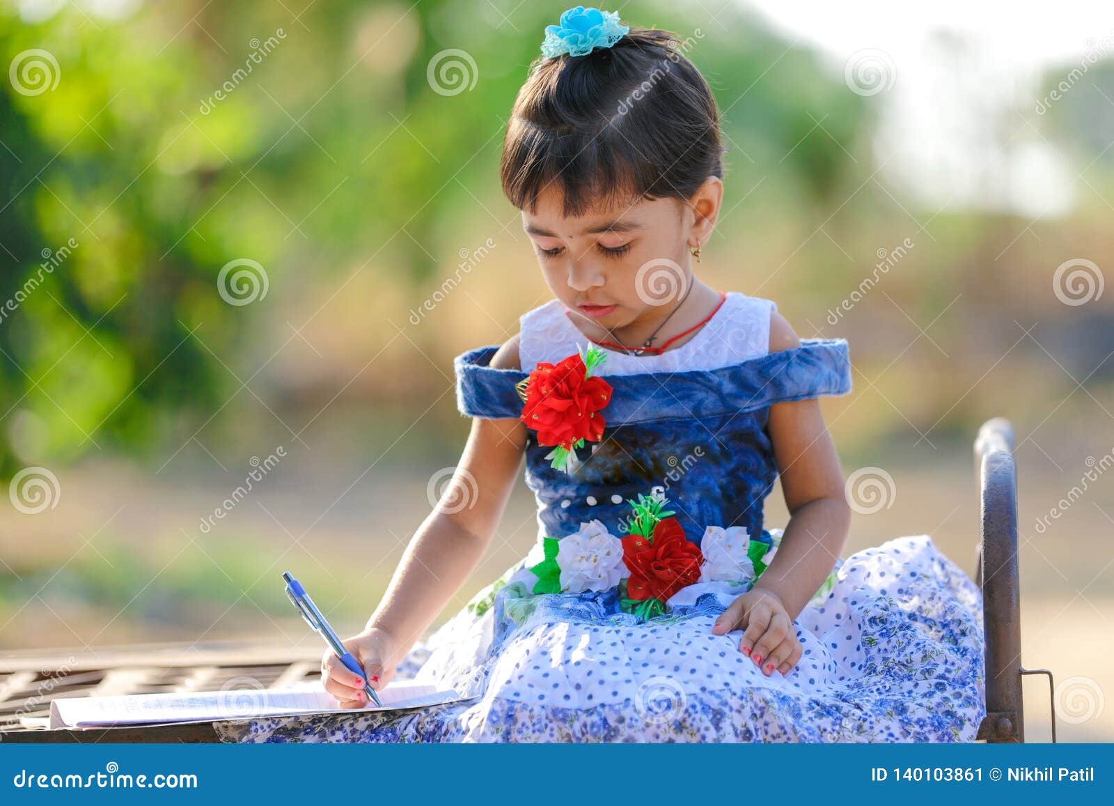 Indian Little Girl Child Writing on Note Book , Studying Stock Image ...