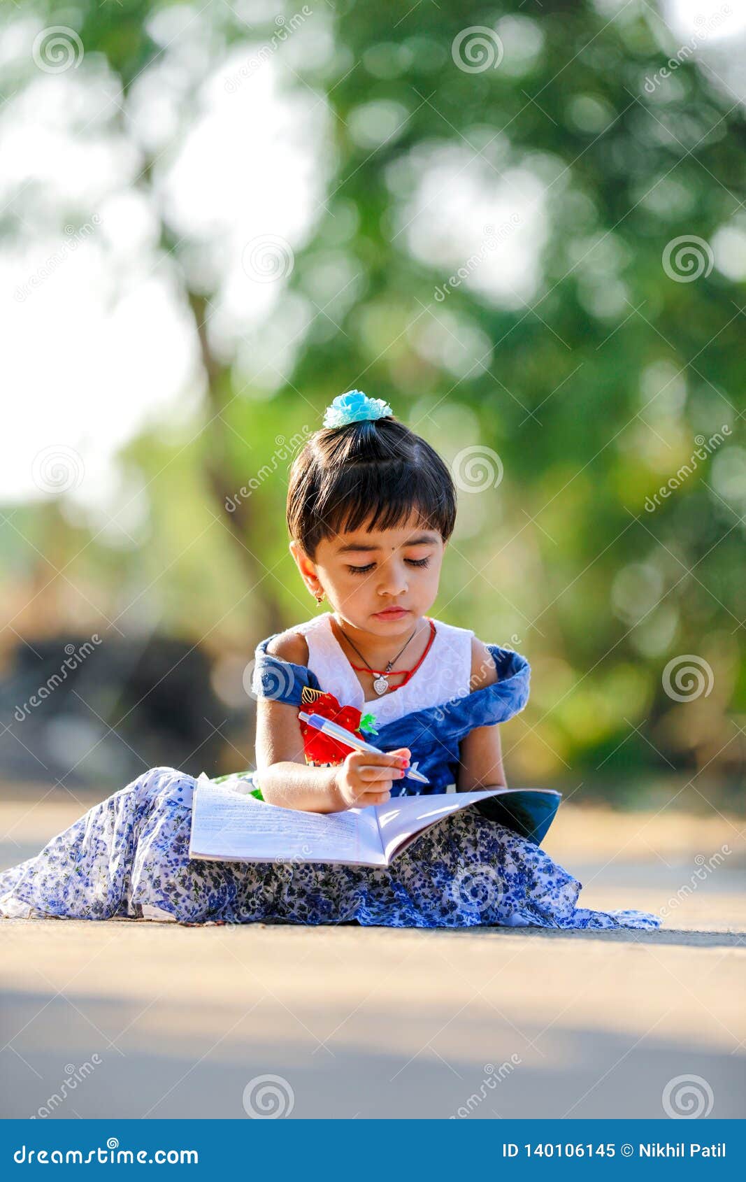 Indian Little Girl Child Writing on Note Book , Studying Stock Image ...