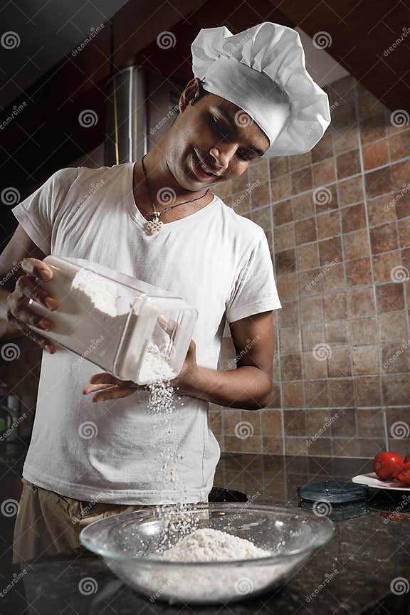 Indian man cooking dinner stock photo. Image of person - 55009964
