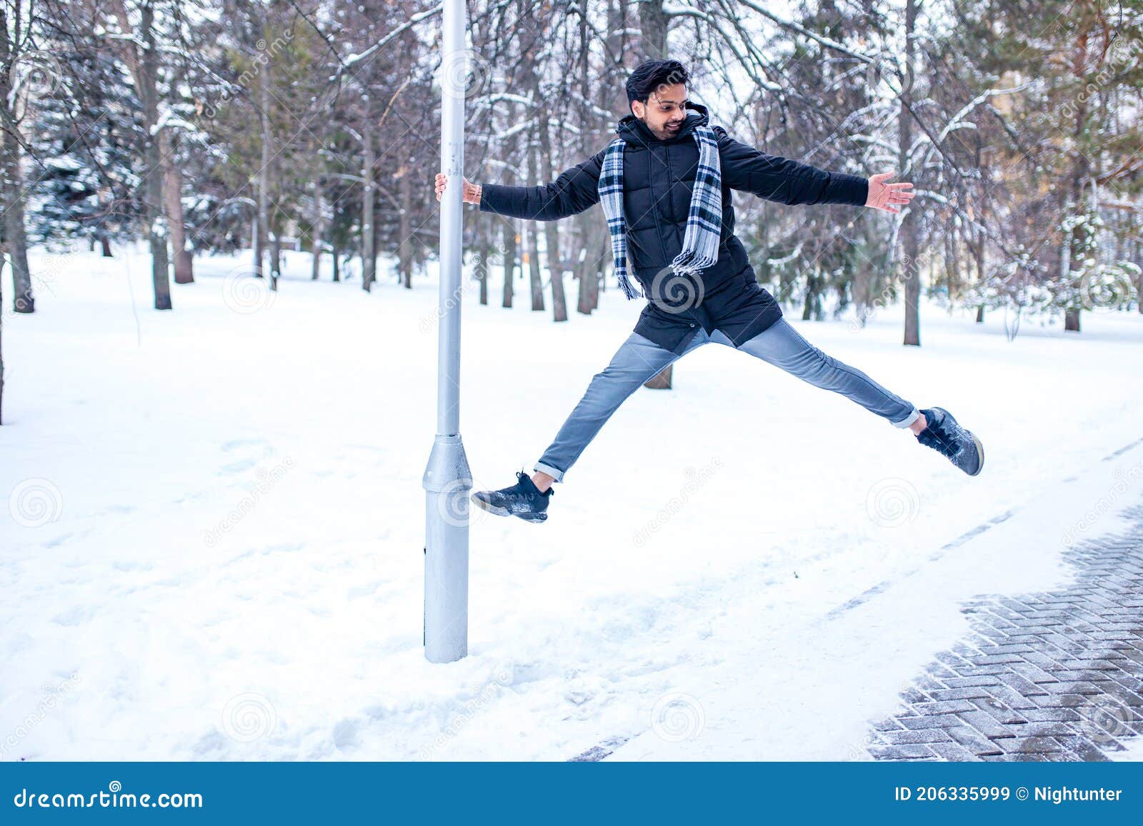 Indian Man Enjoying Snowflakes Falling from Upwards in Forest Stock ...