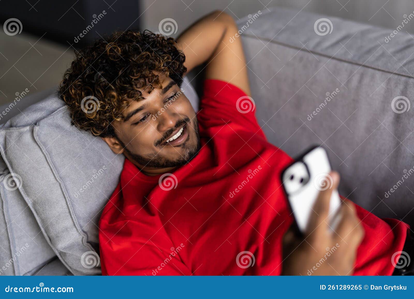 Indian Man Have Video Call Conversation on the Phone Lying at Couch ...