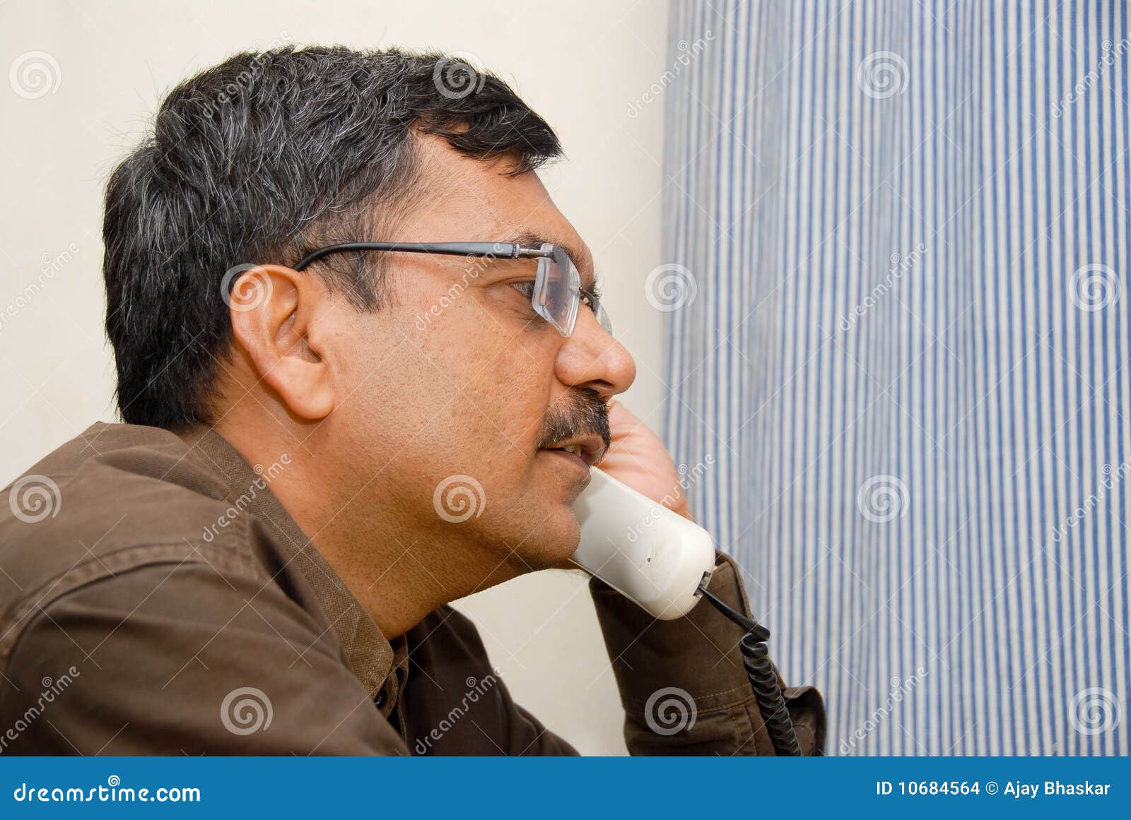 Indian man on phone stock photo. Image of phone, color - 10684564