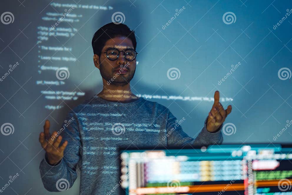 Indian Man Programmer Standing in Front of a Screen with Code Projected ...
