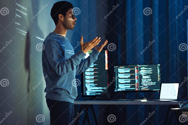 Indian Man Programmer Standing in Front of a Screen with Code Projected ...