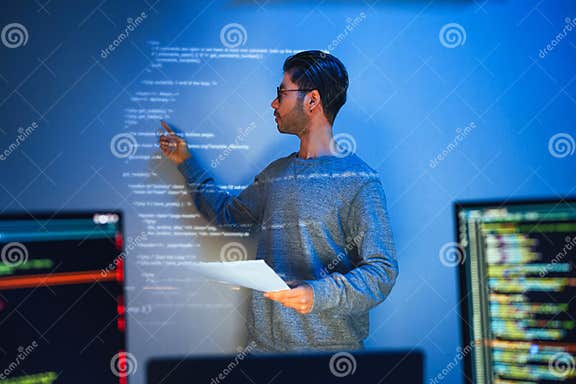 Indian Man Programmer Standing in Front of a Screen with Code Projected ...