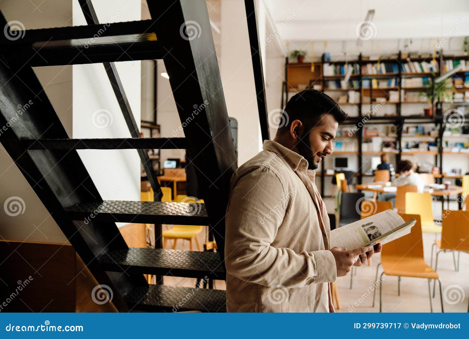 Indian Man Reading Book while Standing in Library Stock Image - Image ...