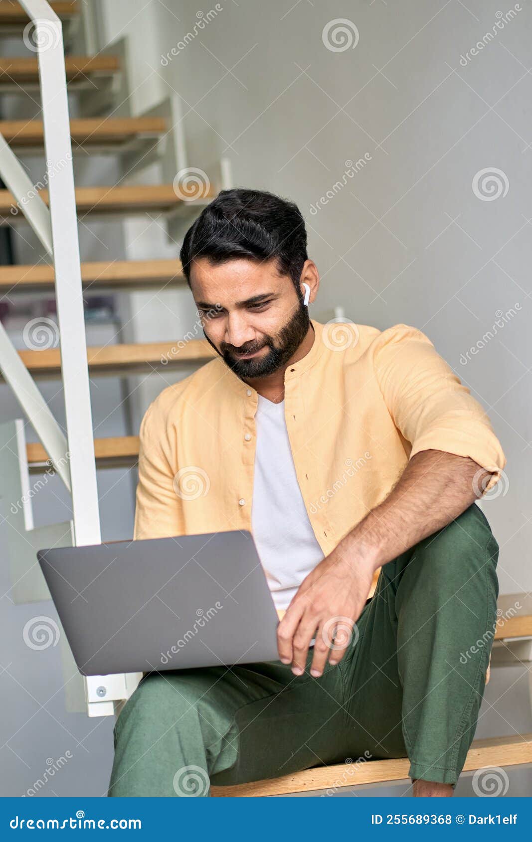 Indian Man User Sitting at Home Using Laptop Remote Working, Vertical ...
