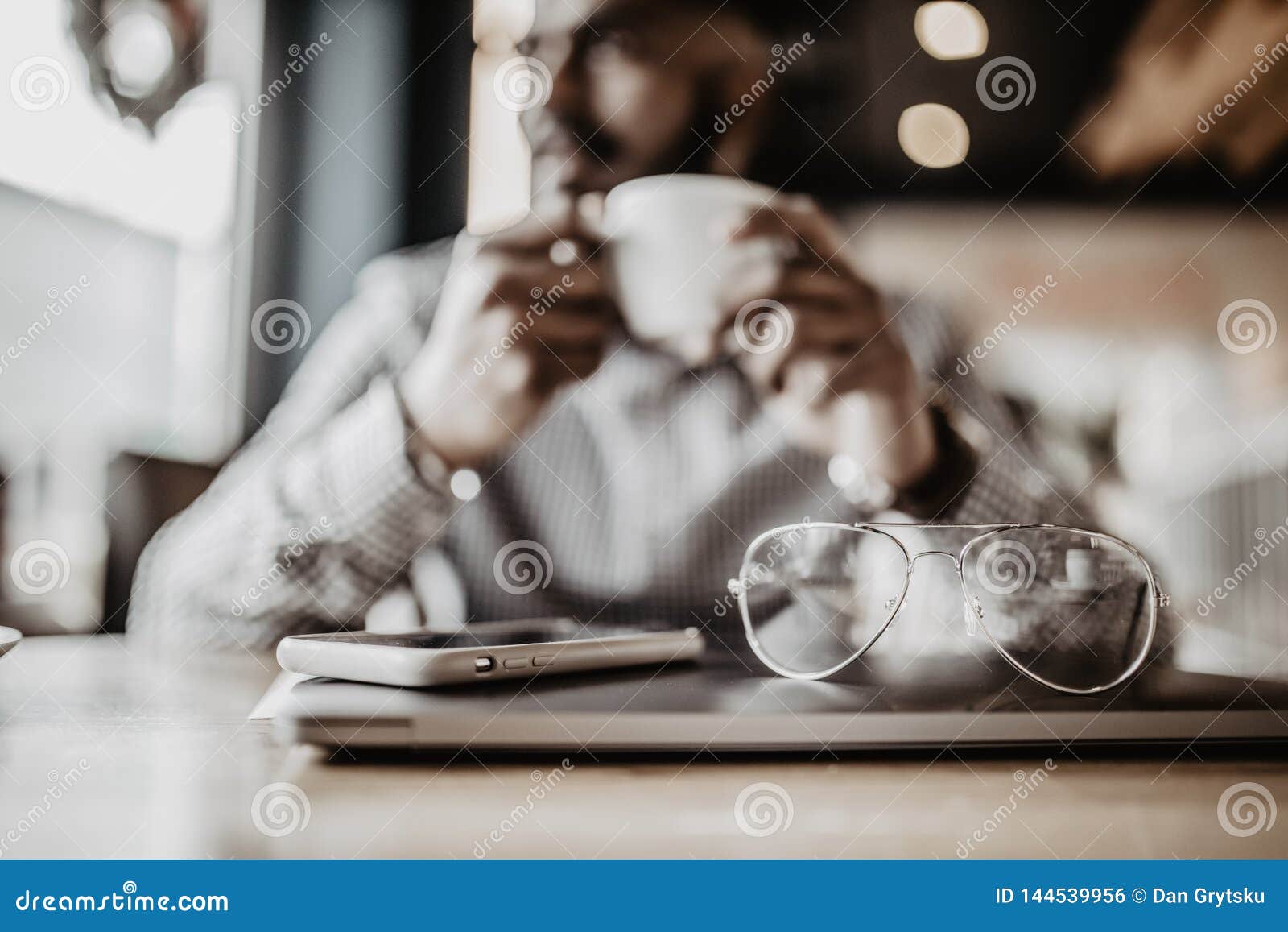 Indian Man Using Laptop Computer while Drinking a Cup Hot Milk Tea ...