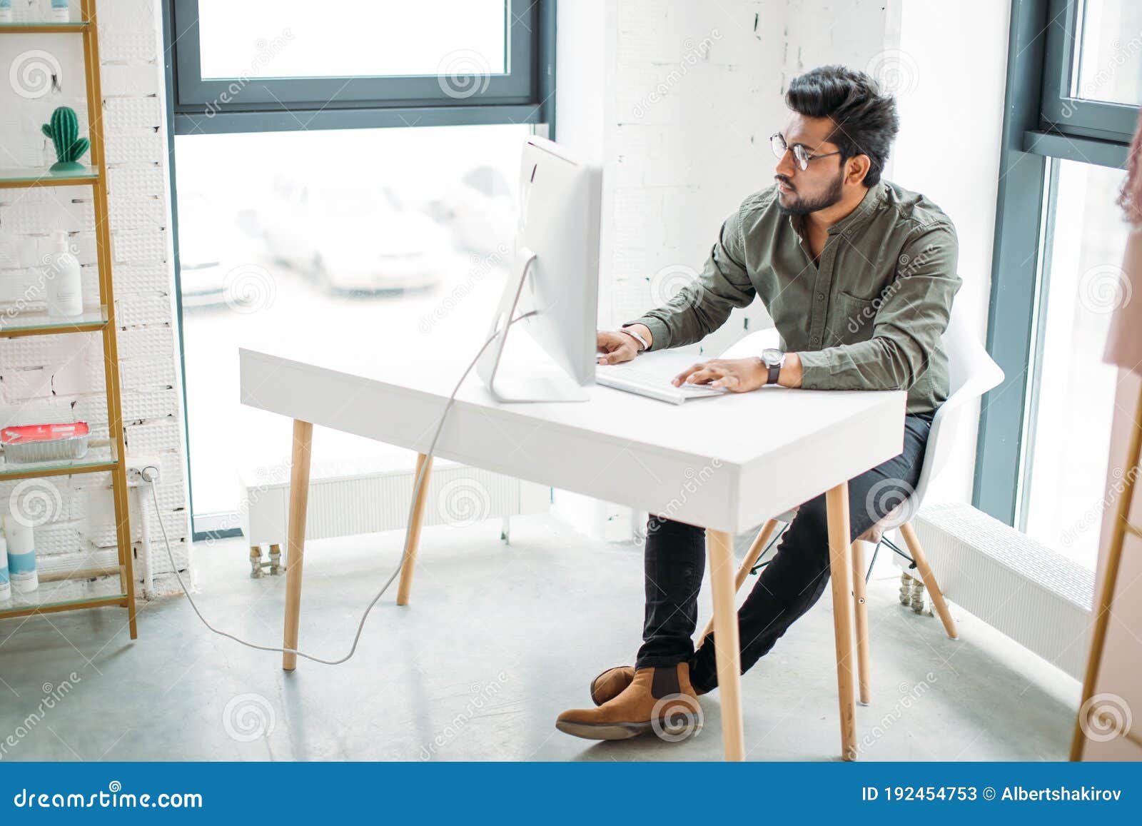 Indian Man Working at Computer from Modern Bright Office Stock Image ...