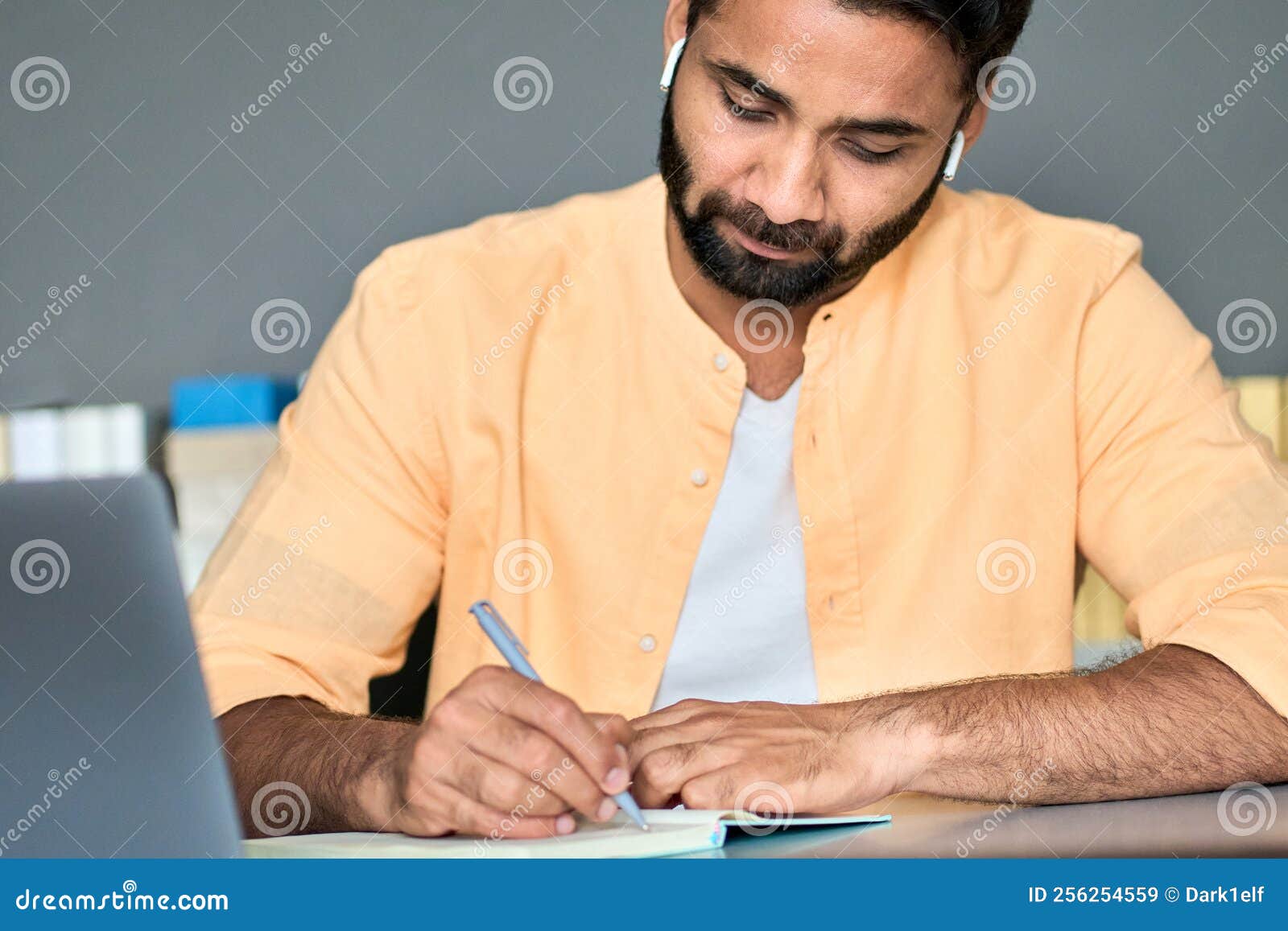 Indian Man Writing Notes while Learning Online Business Education ...
