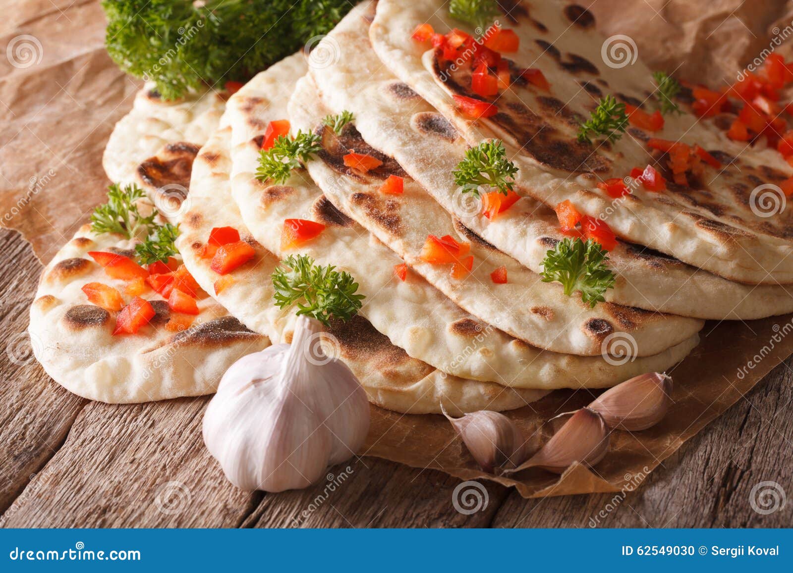 Indian Naan Flat Bread with Garlic and Herbs Closeup. Horizontal Stock ...
