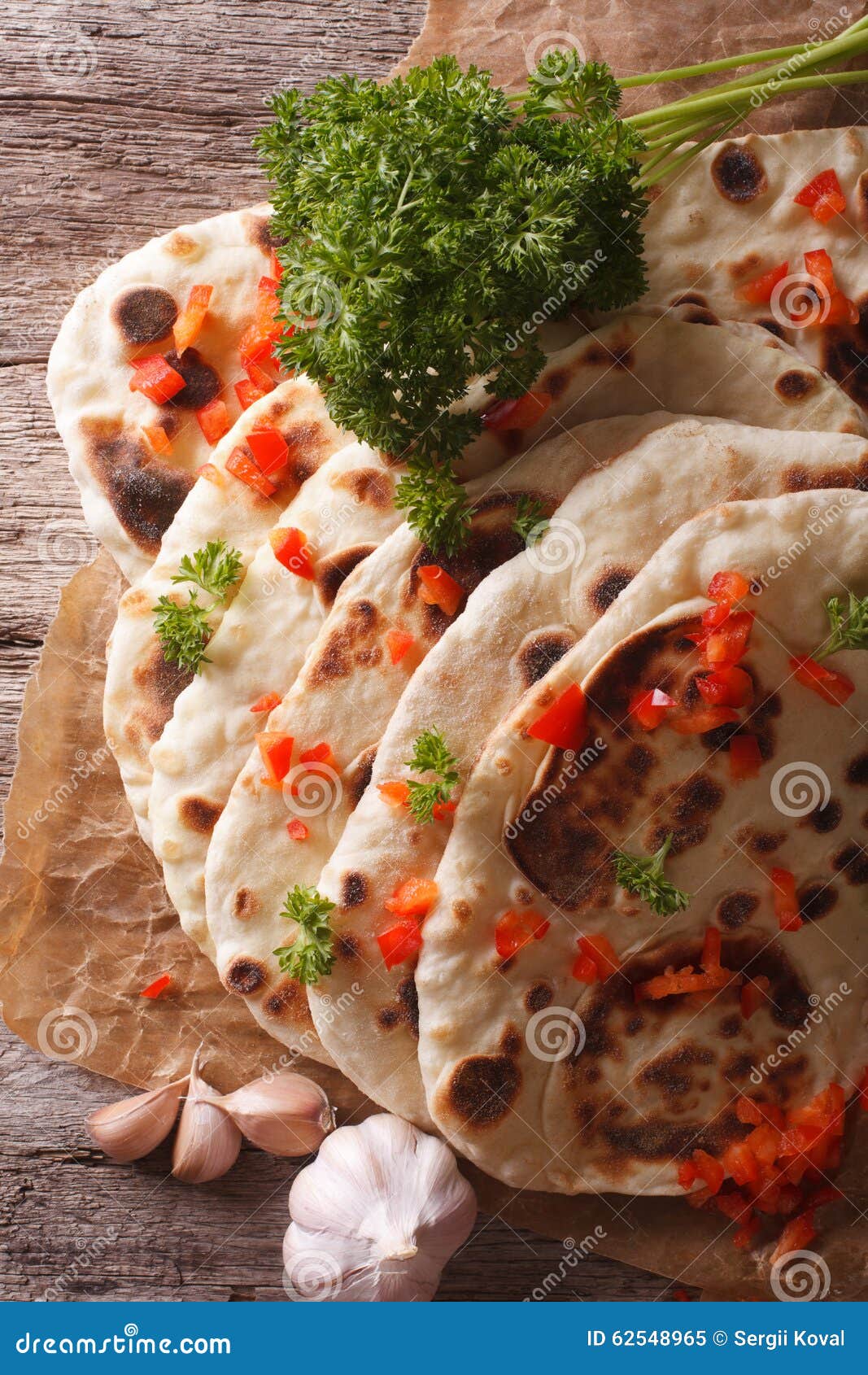 Indian Naan Flat Bread with Garlic and Herbs. Vertical Top View Stock ...