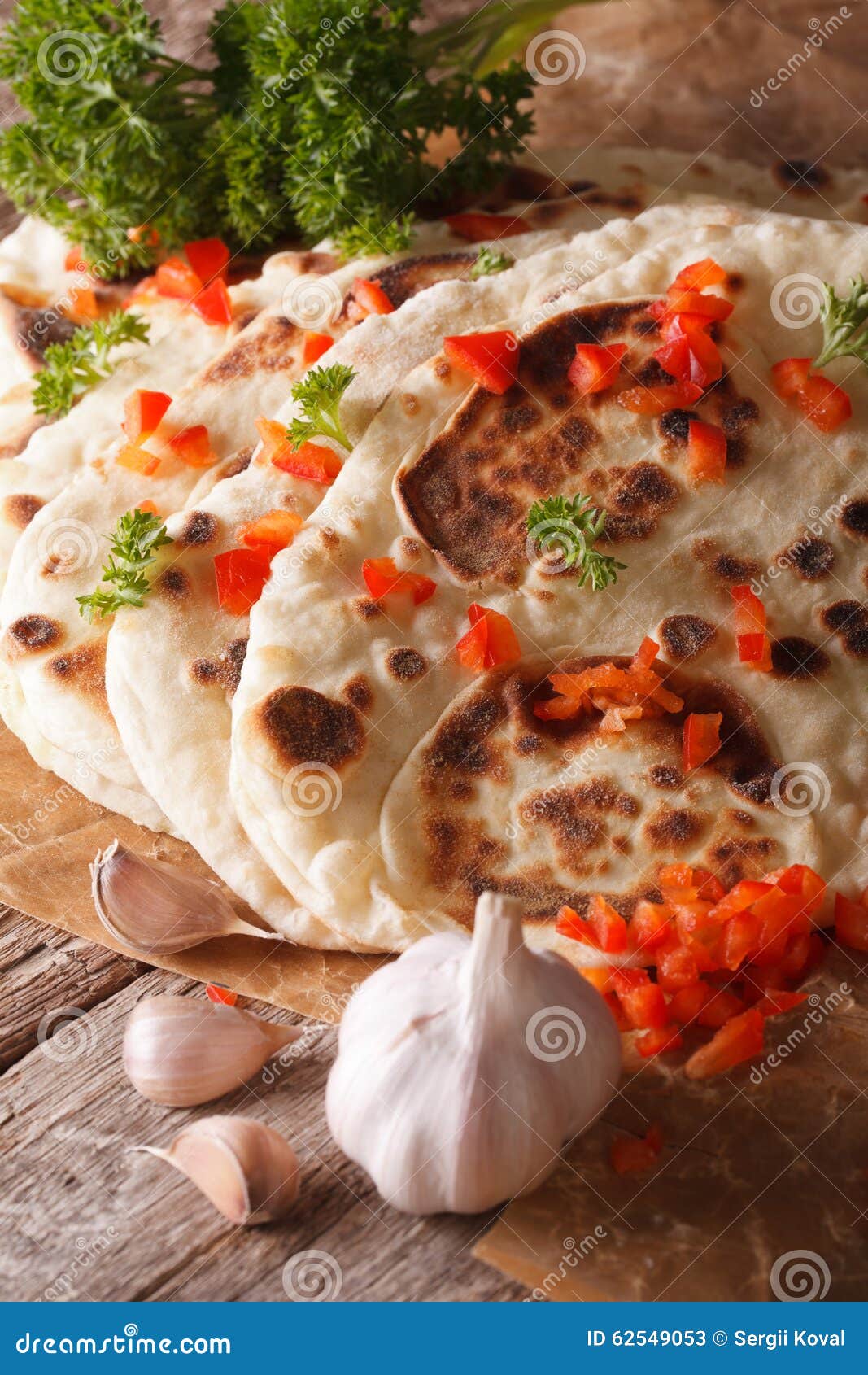 Indian Naan Flat Bread with Garlic and Pepper Macro. Vertical Stock ...