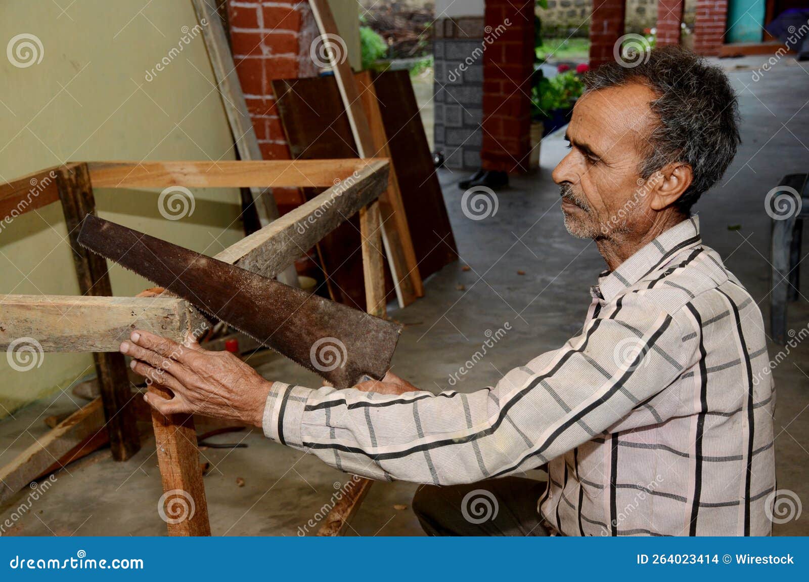 Indian Old Man Working in a Wood Workshop with a Saw Stock Photo ...