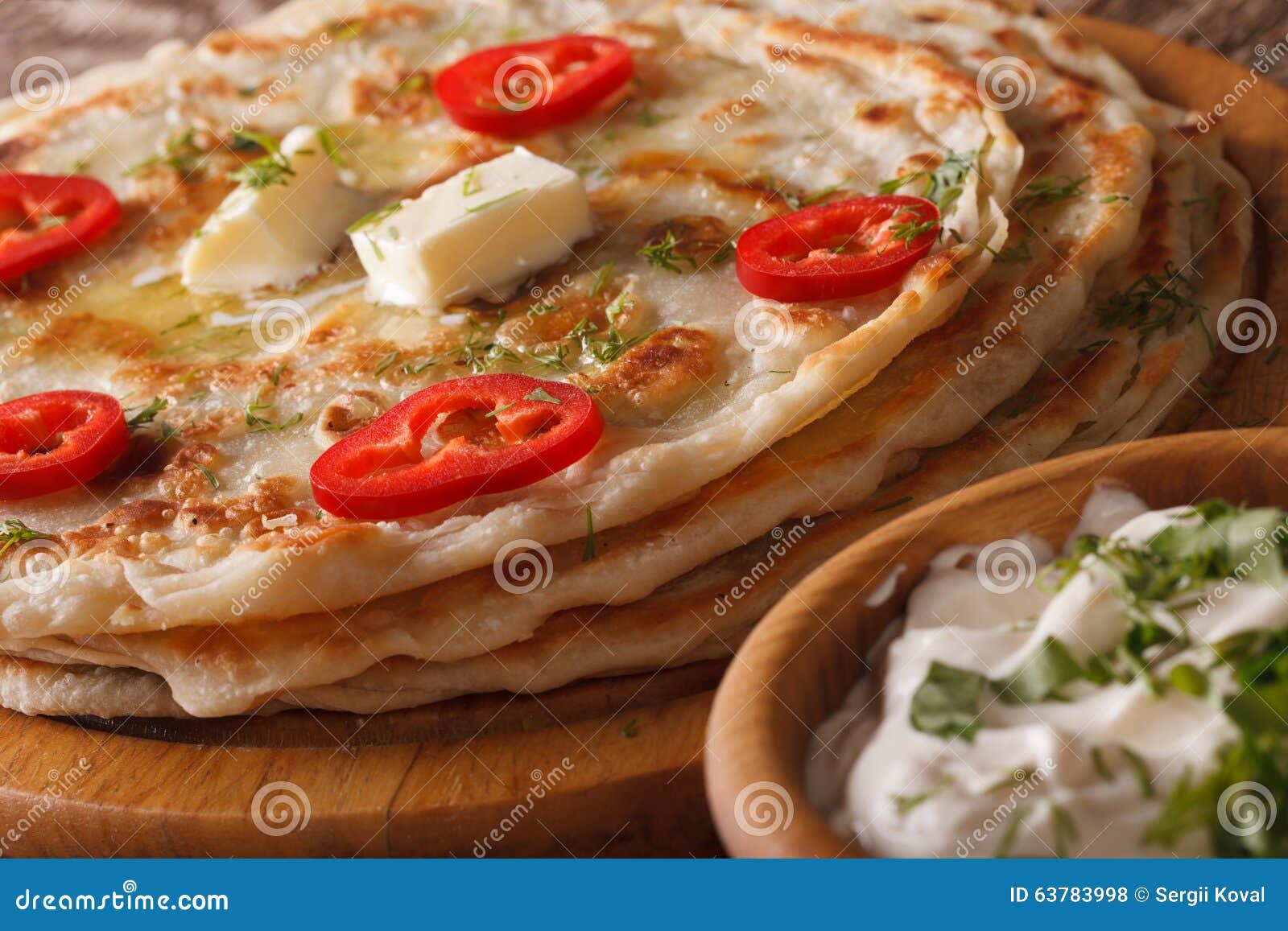 Indian Paratha with Butter and Herbs Macro. Horizontal Stock Photo ...