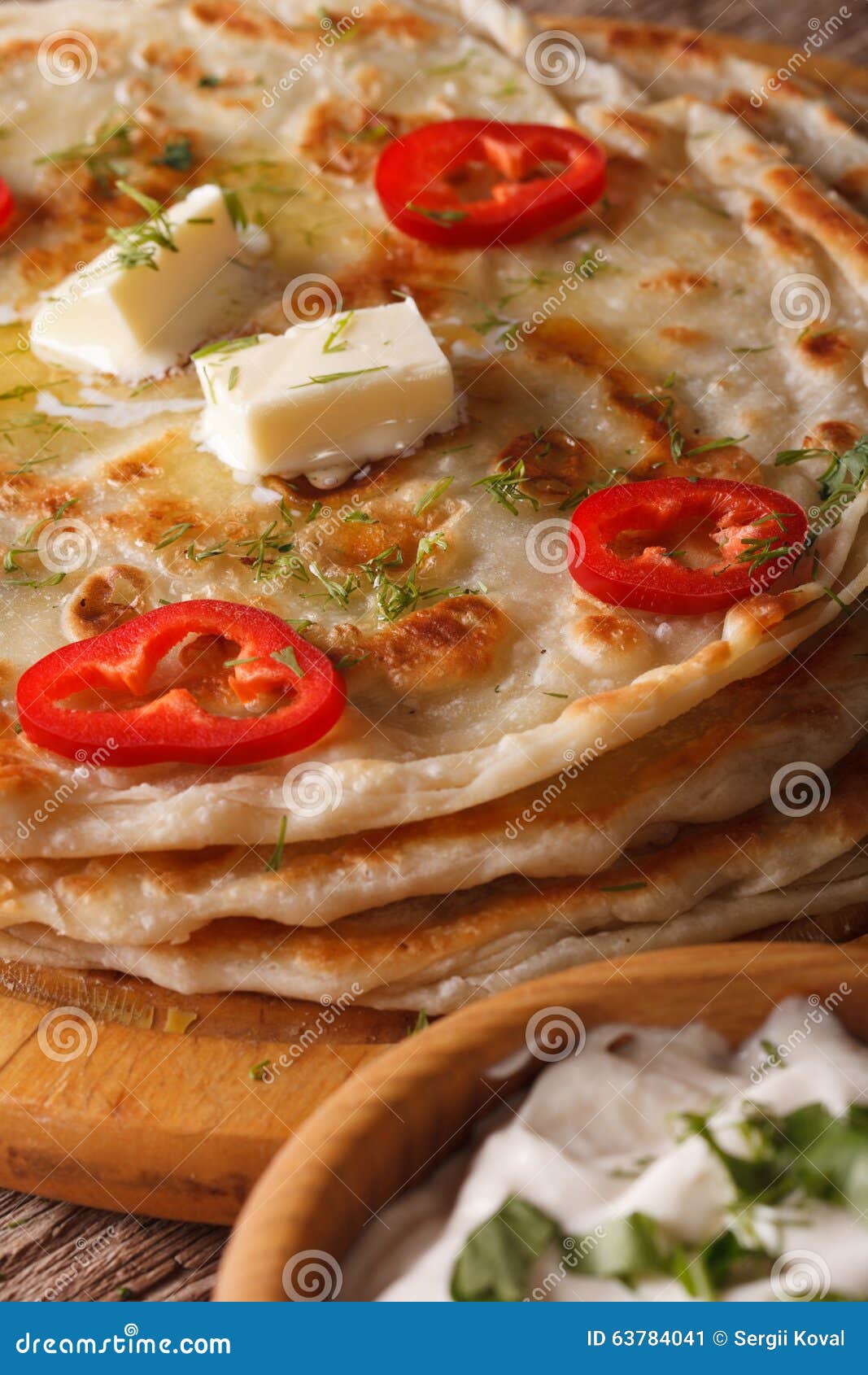 Indian Paratha with Butter and Herbs Macro. Vertical Stock Image ...