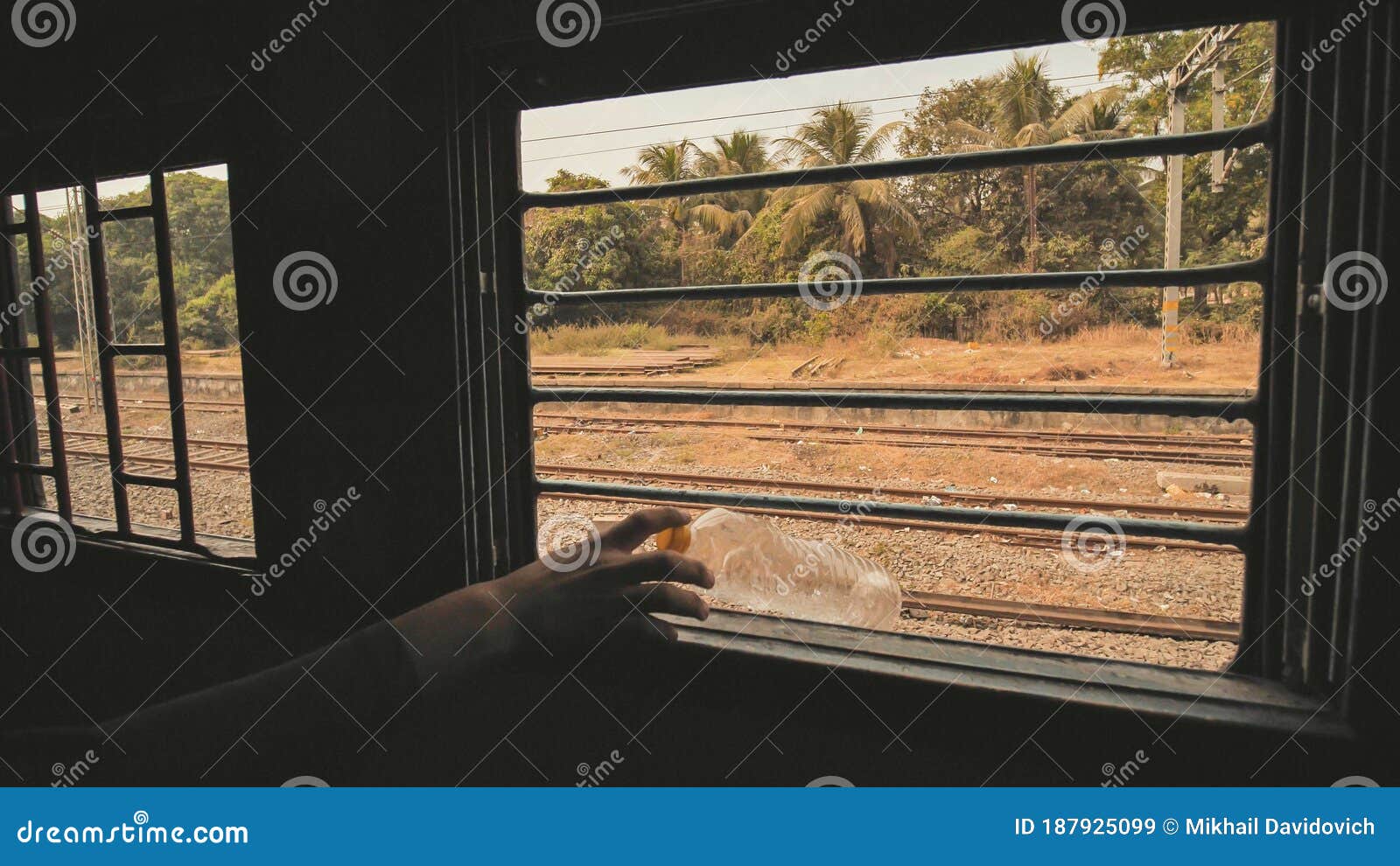 Indian People Throw a Plastic Bottle and Garbage from the Train Window ...