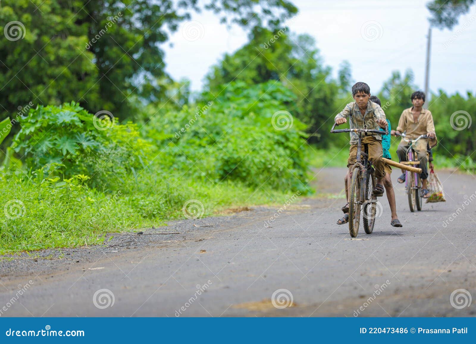 Indian poor child on cycle editorial photo. Image of india - 220473486