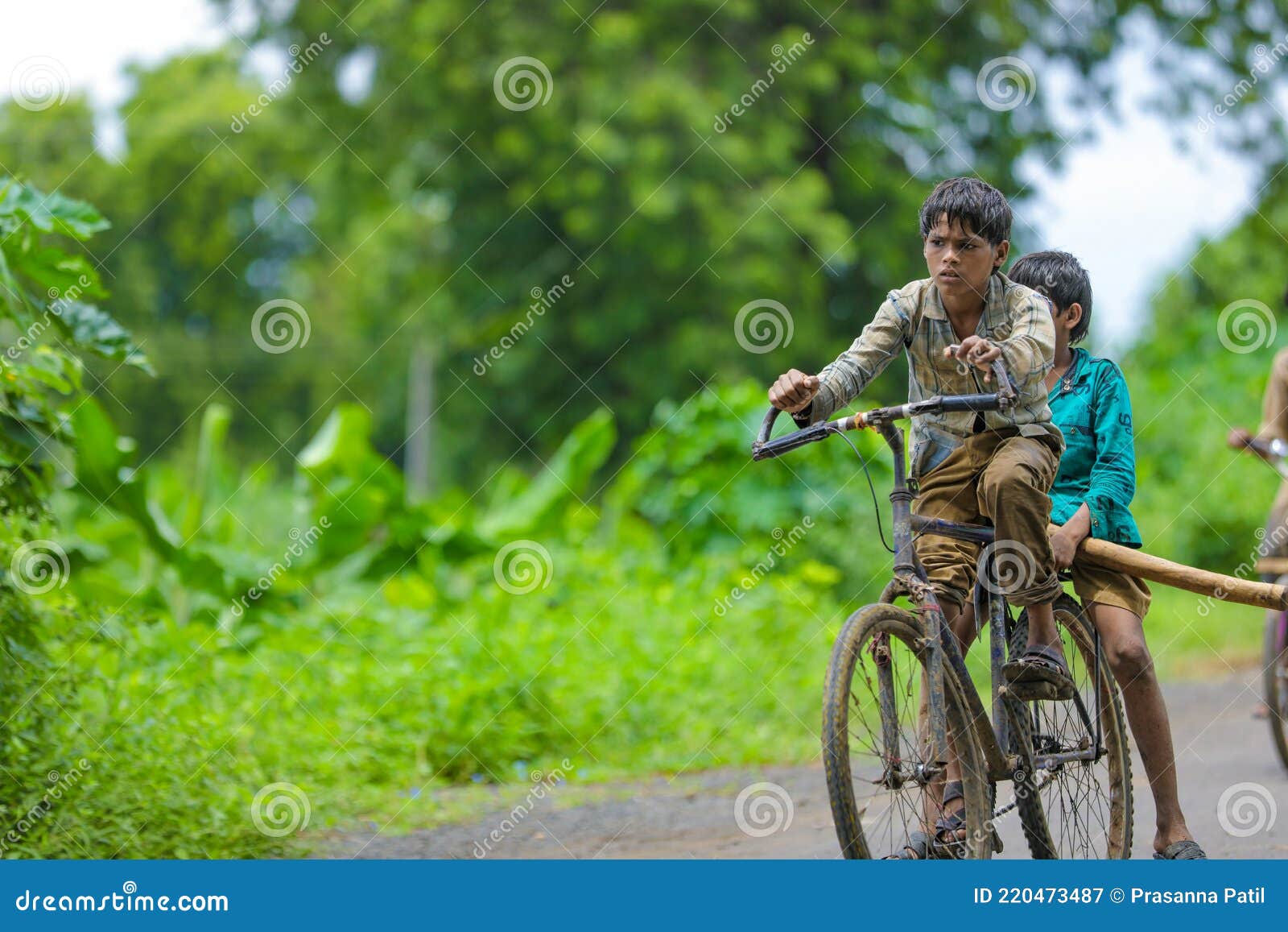 Indian poor child on cycle editorial photography. Image of joyride ...